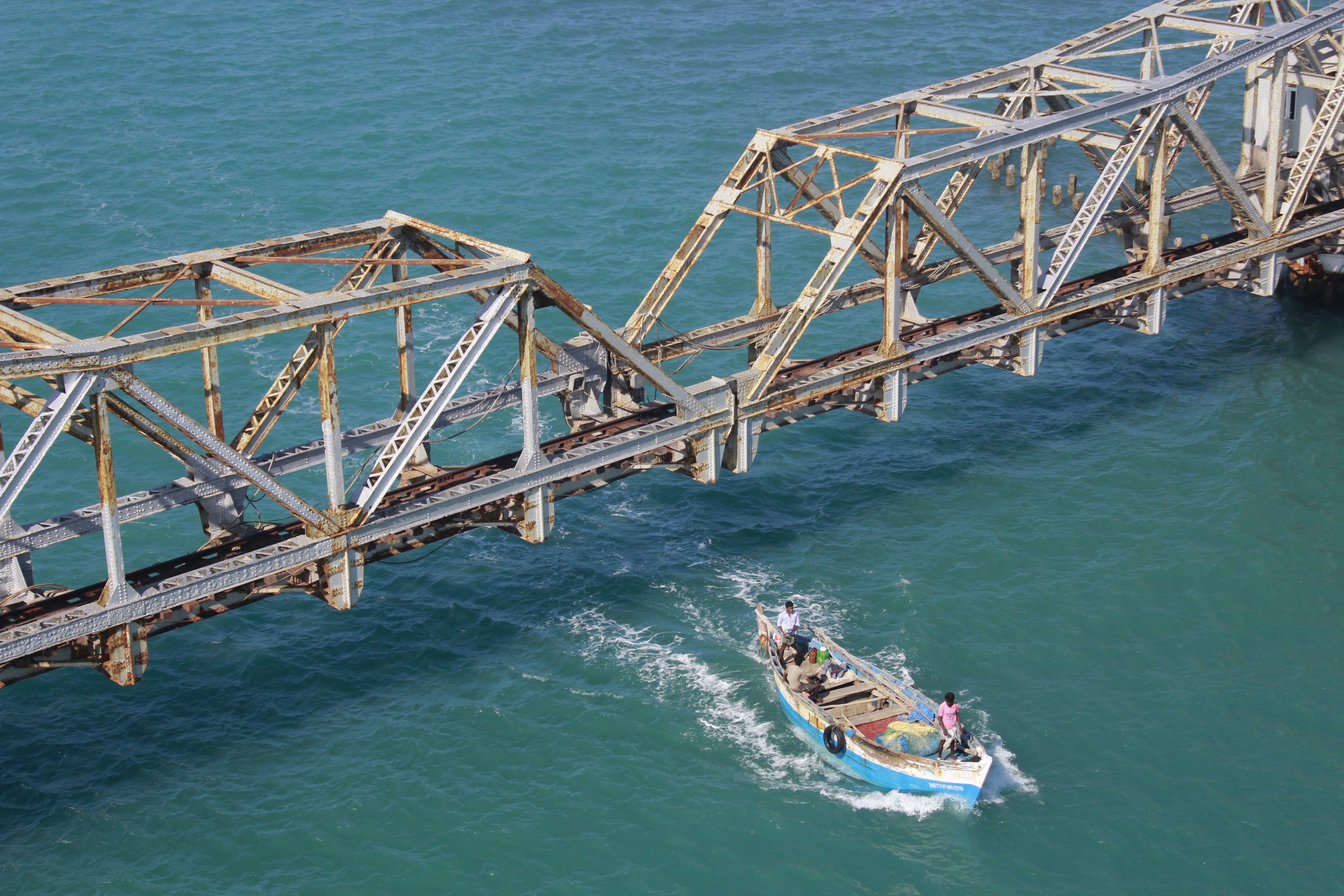 Fishing Boat Passing Under Rusty Pamban Bridge · Free Stock Photo