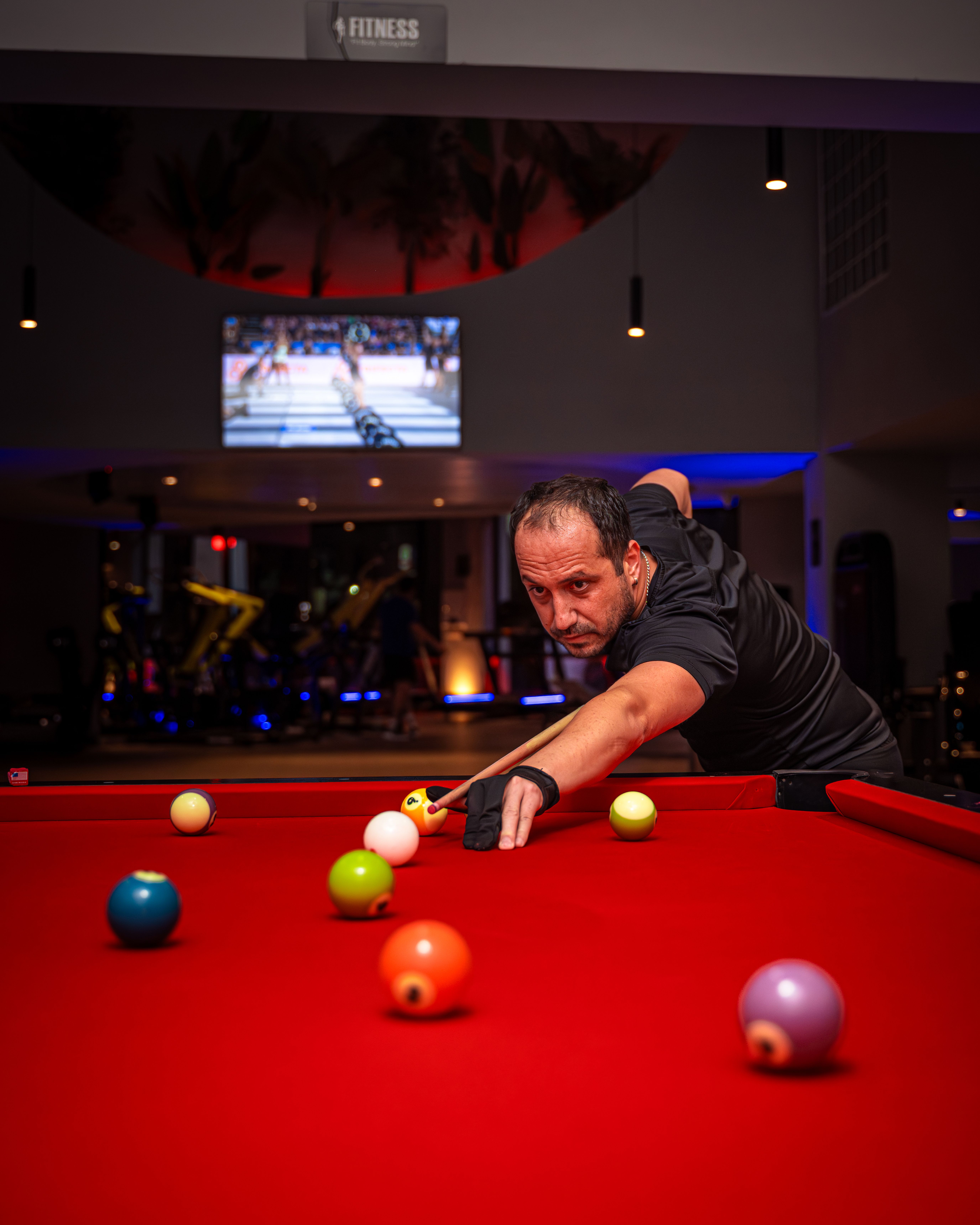 Man Playing Pool in Modern Indoor Setting · meta.free_stock.photo