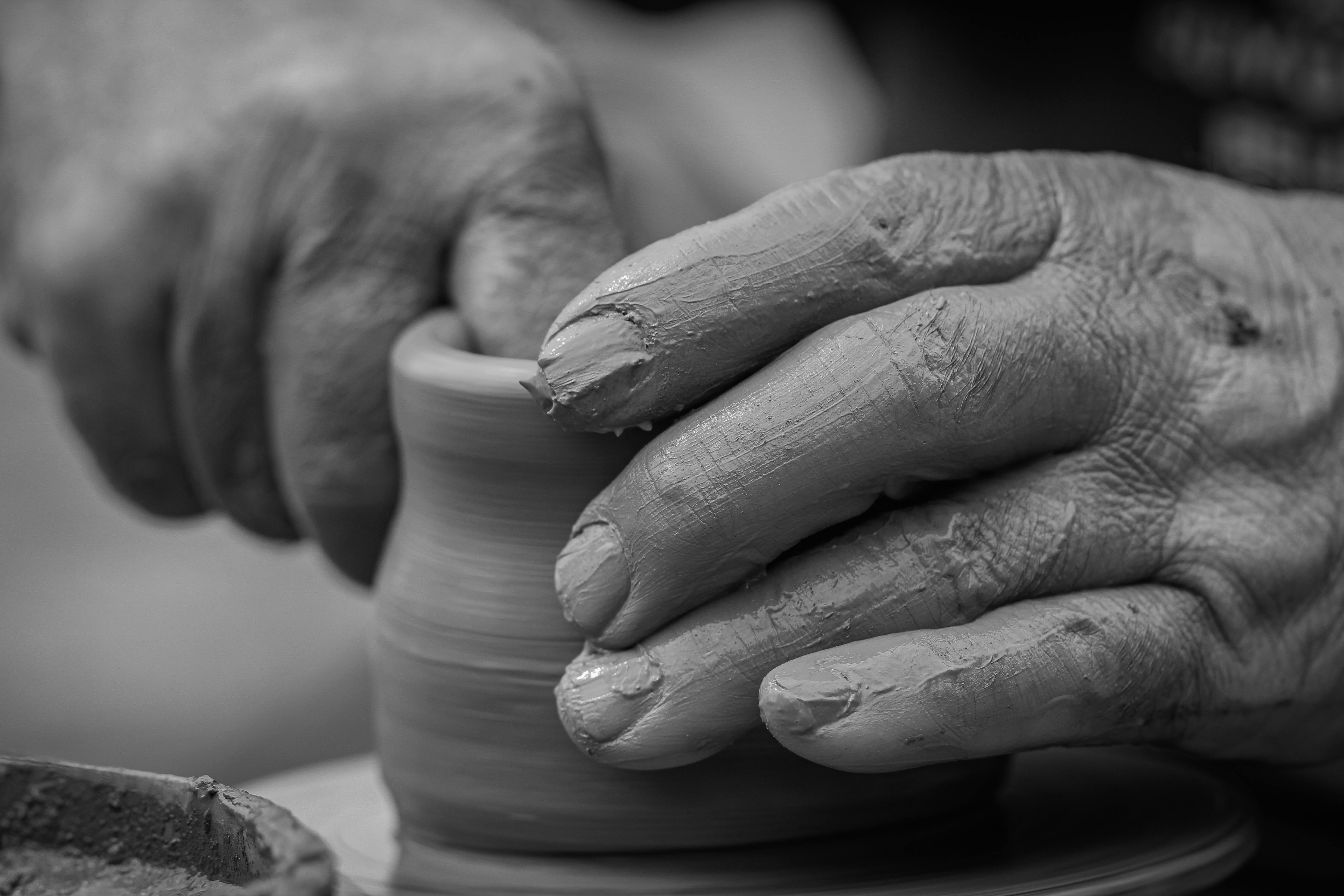Close-Up of Hands Crafting a Clay Pot on Wheel · Free Stock Photo