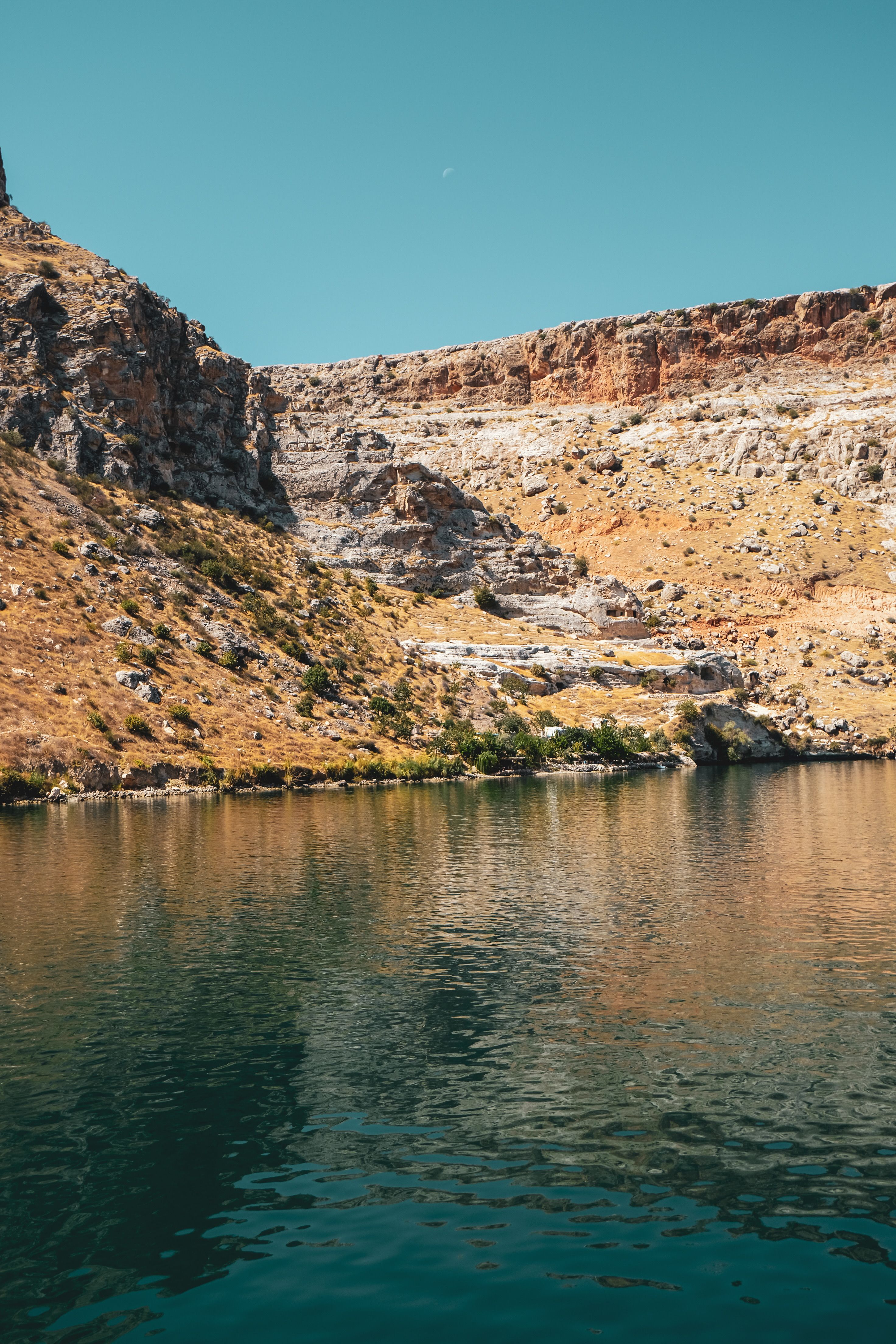 Scenic Rocky Cliff by Tranquil Lake in Summer · Free Stock Photo
