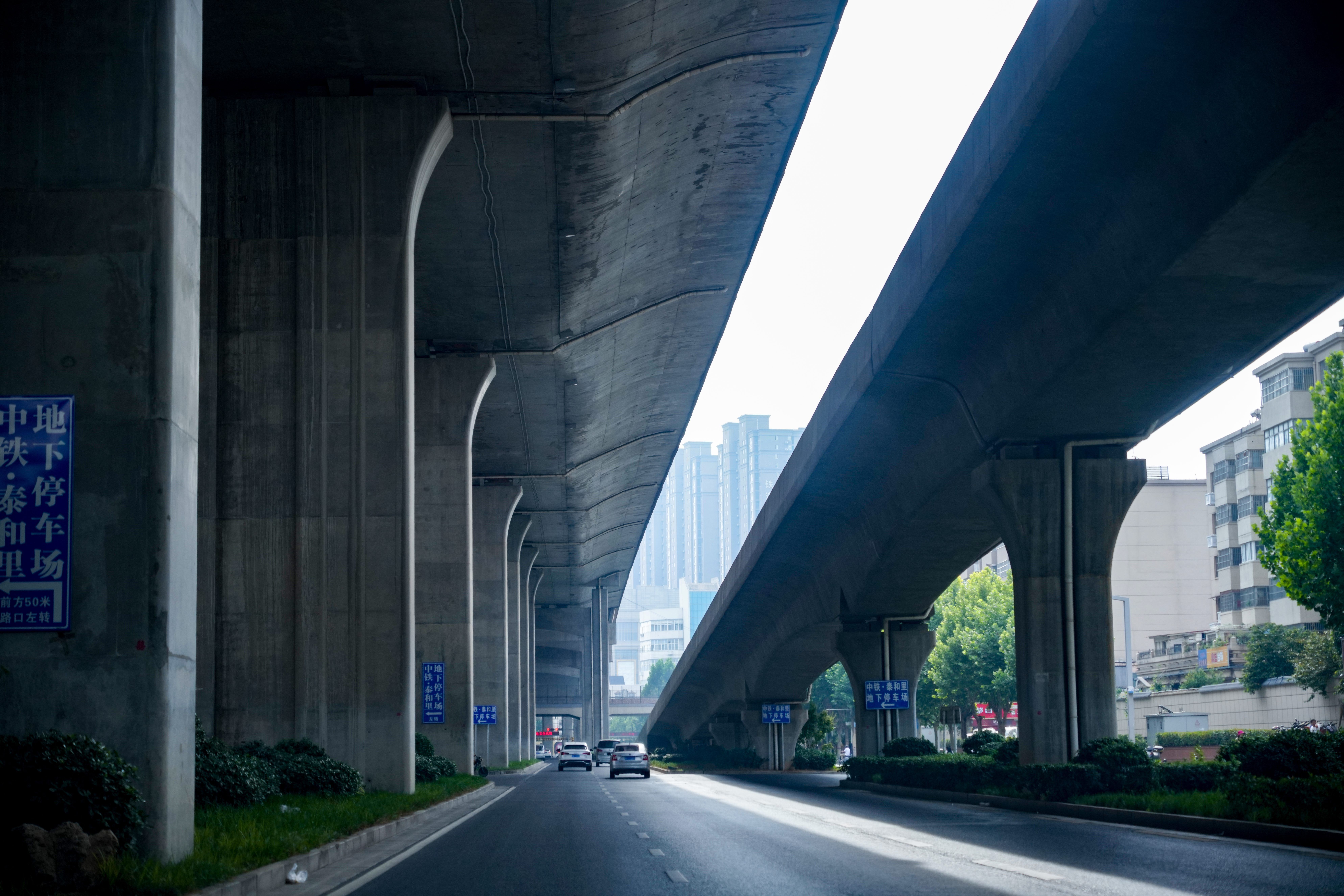 Urban Highway Underpass with Cityscape View · Free Stock Photo