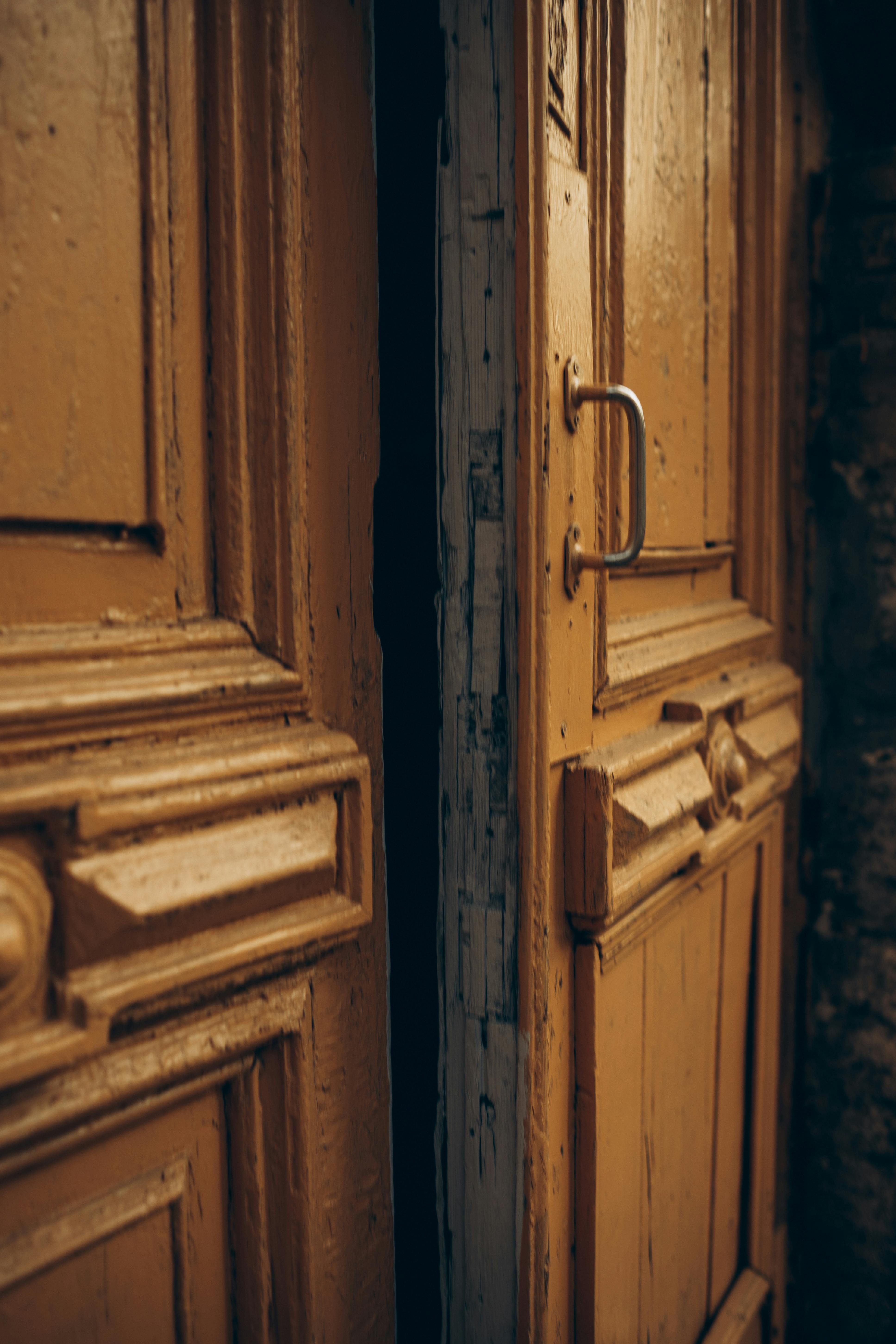 Partially Opened Antique Wooden Door in Moody Light · Free Stock Photo