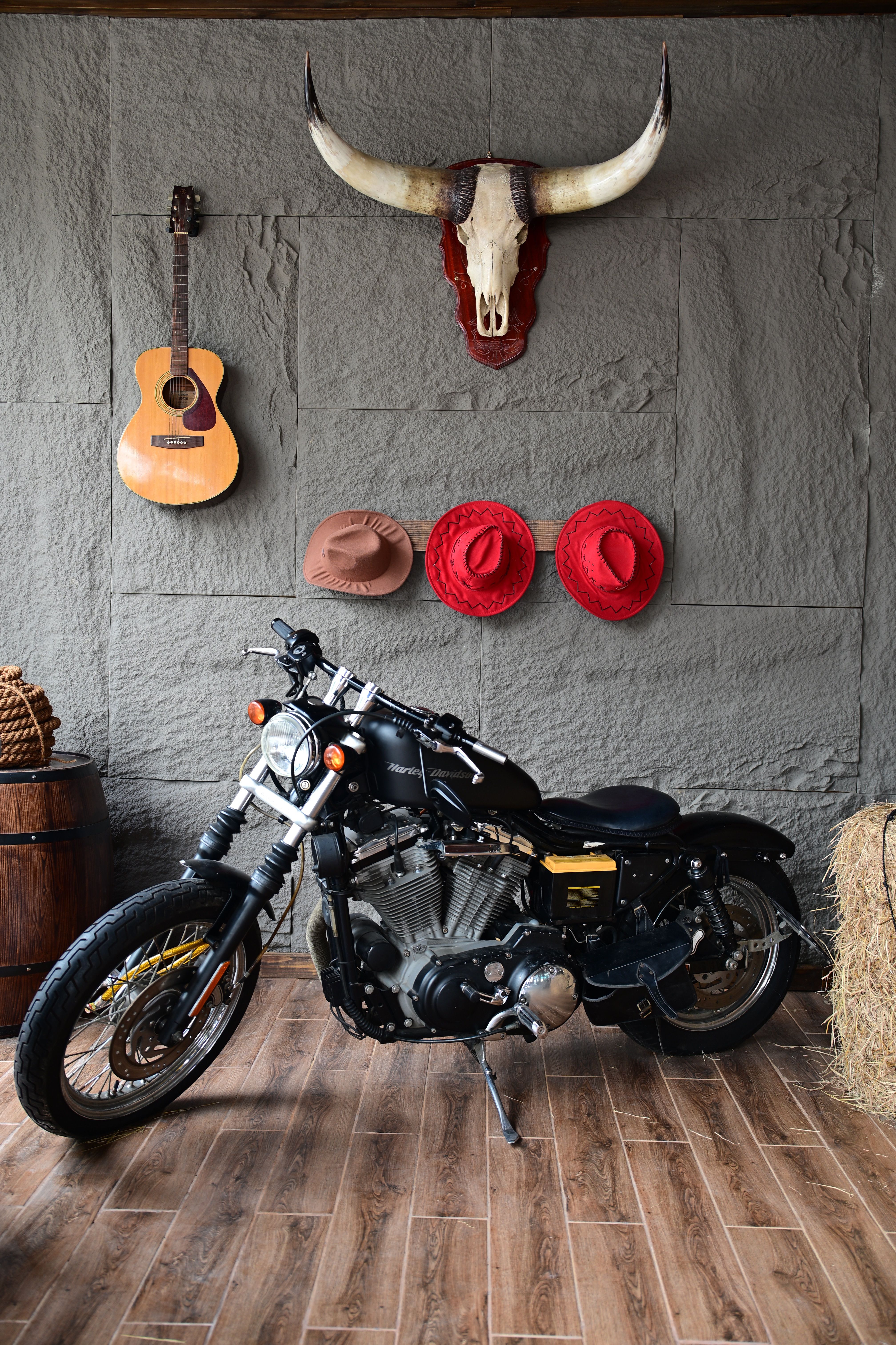 Vintage Motorcycle with Western Decor in Rustic Room · Free Stock Photo