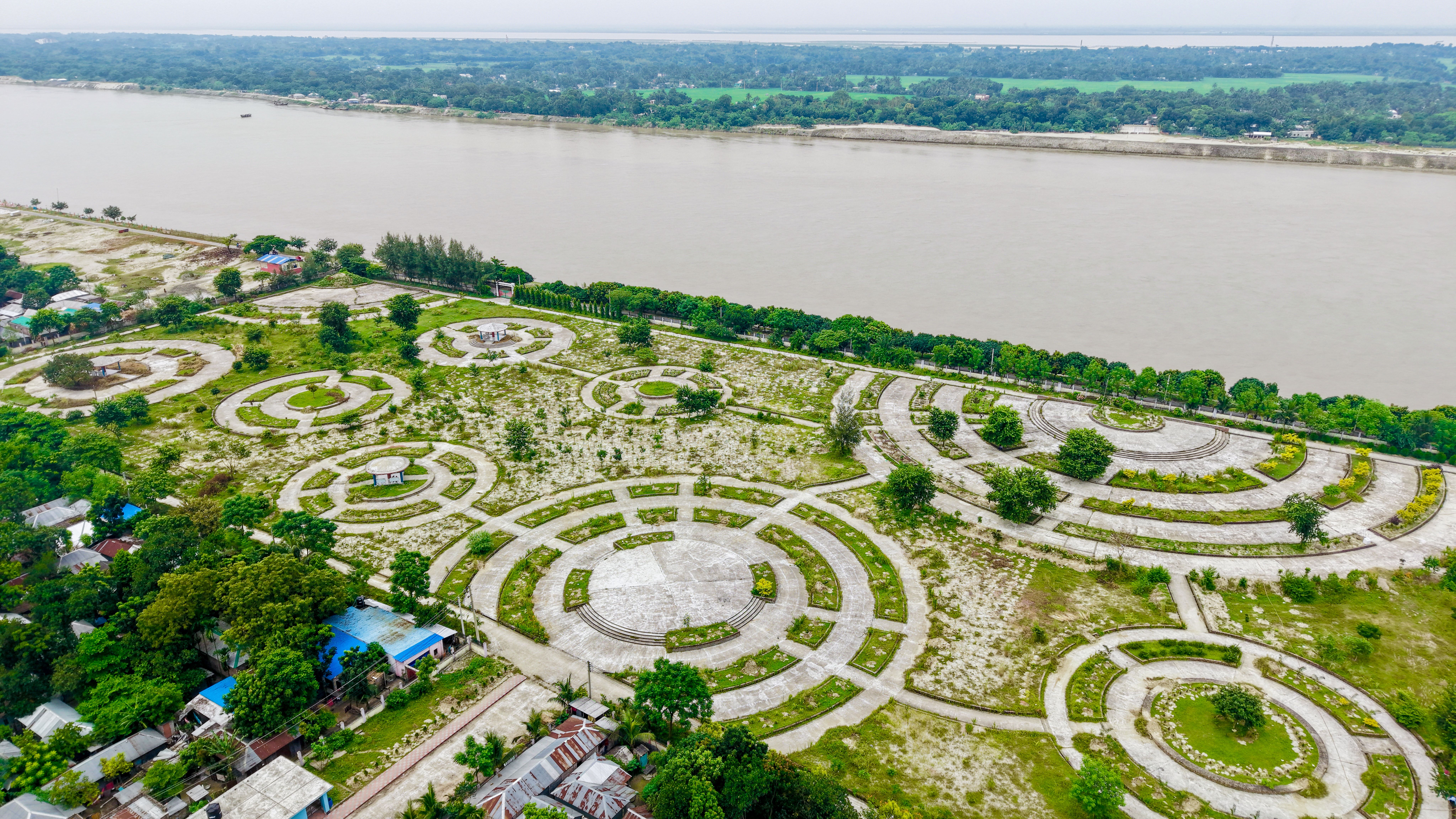 Aerial View of Circular Park by Riverside · Free Stock Photo