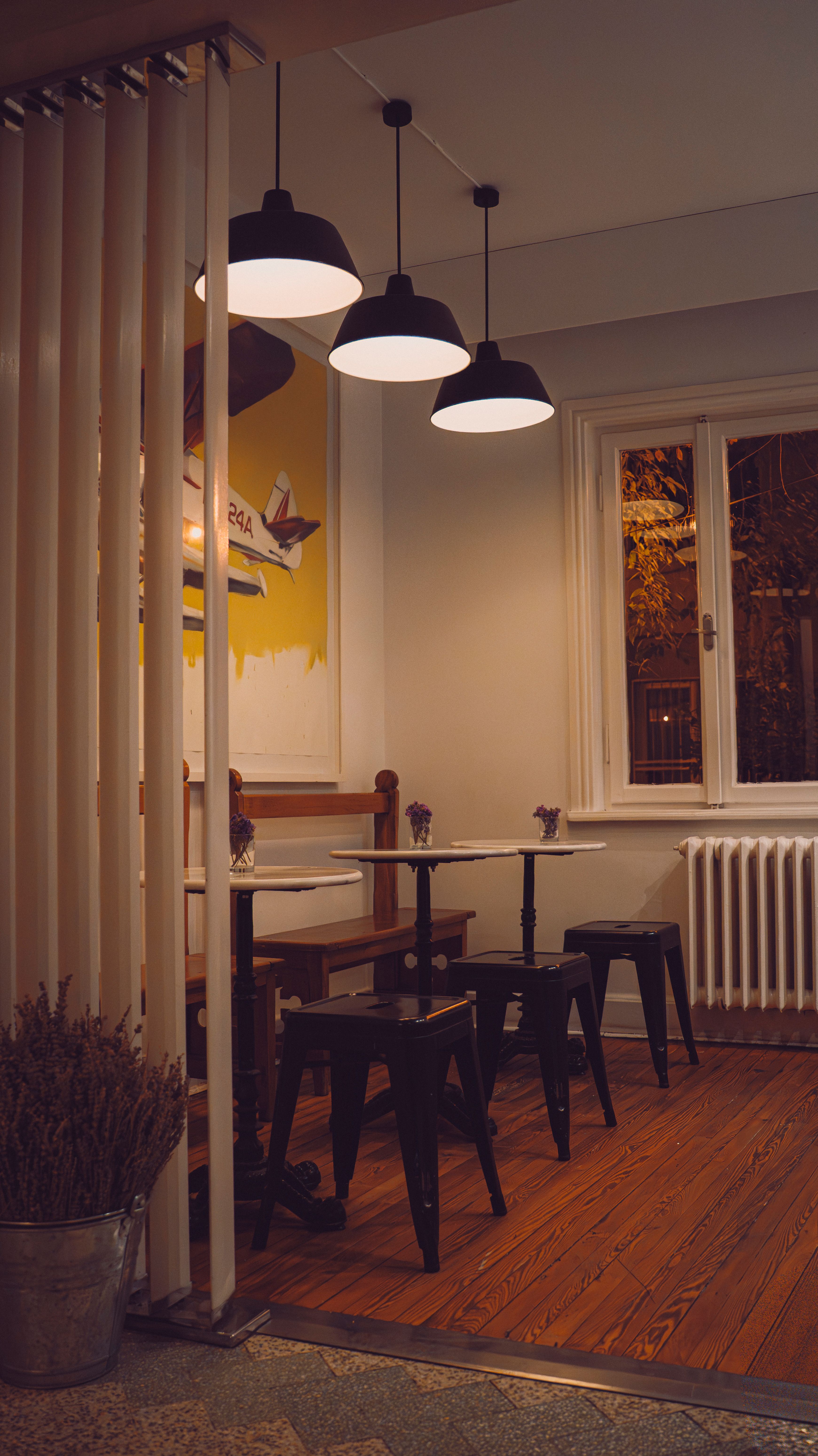 Cozy Indoor Cafe with Ambient Lighting · Free Stock Photo