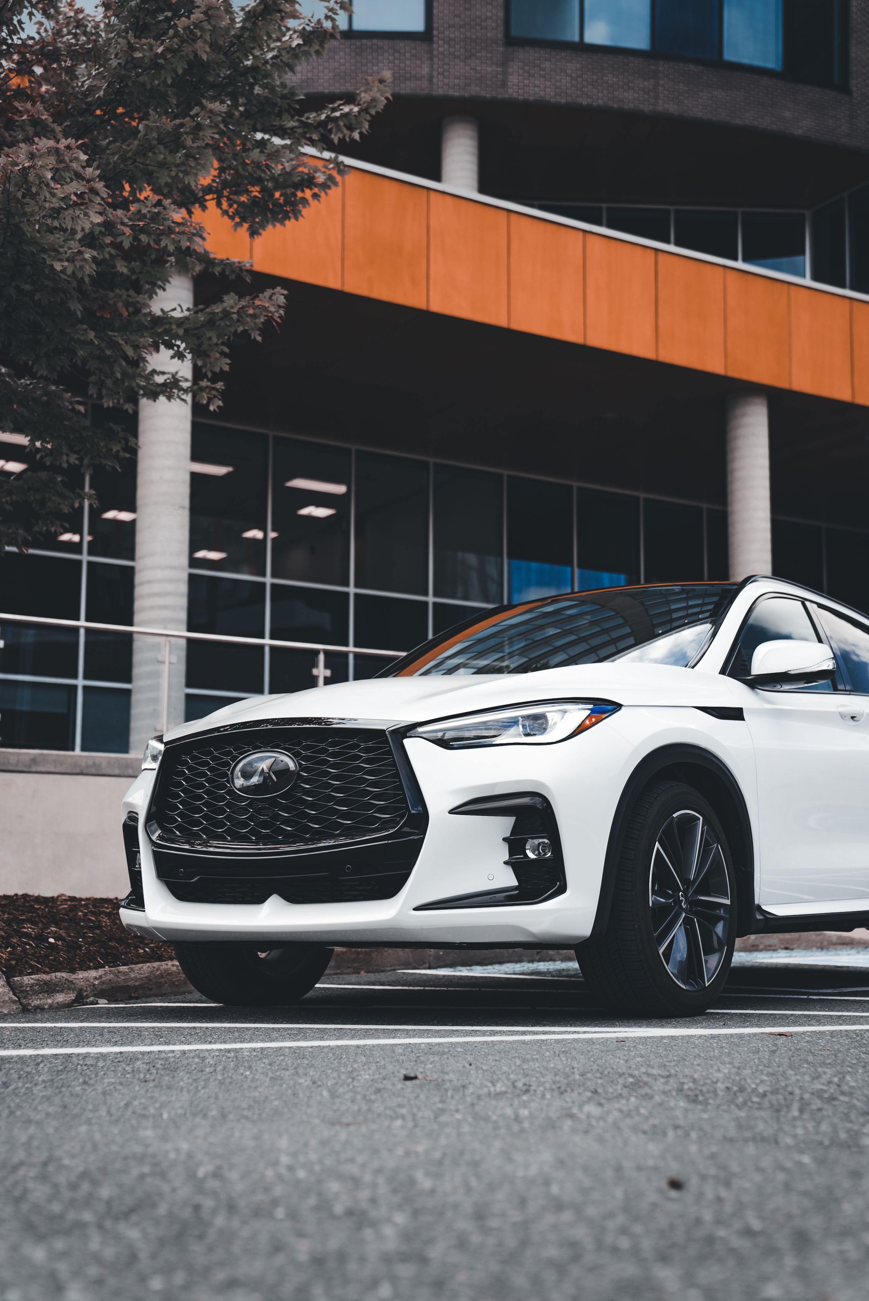 Modern White SUV Parked in Urban Setting · Free Stock Photo