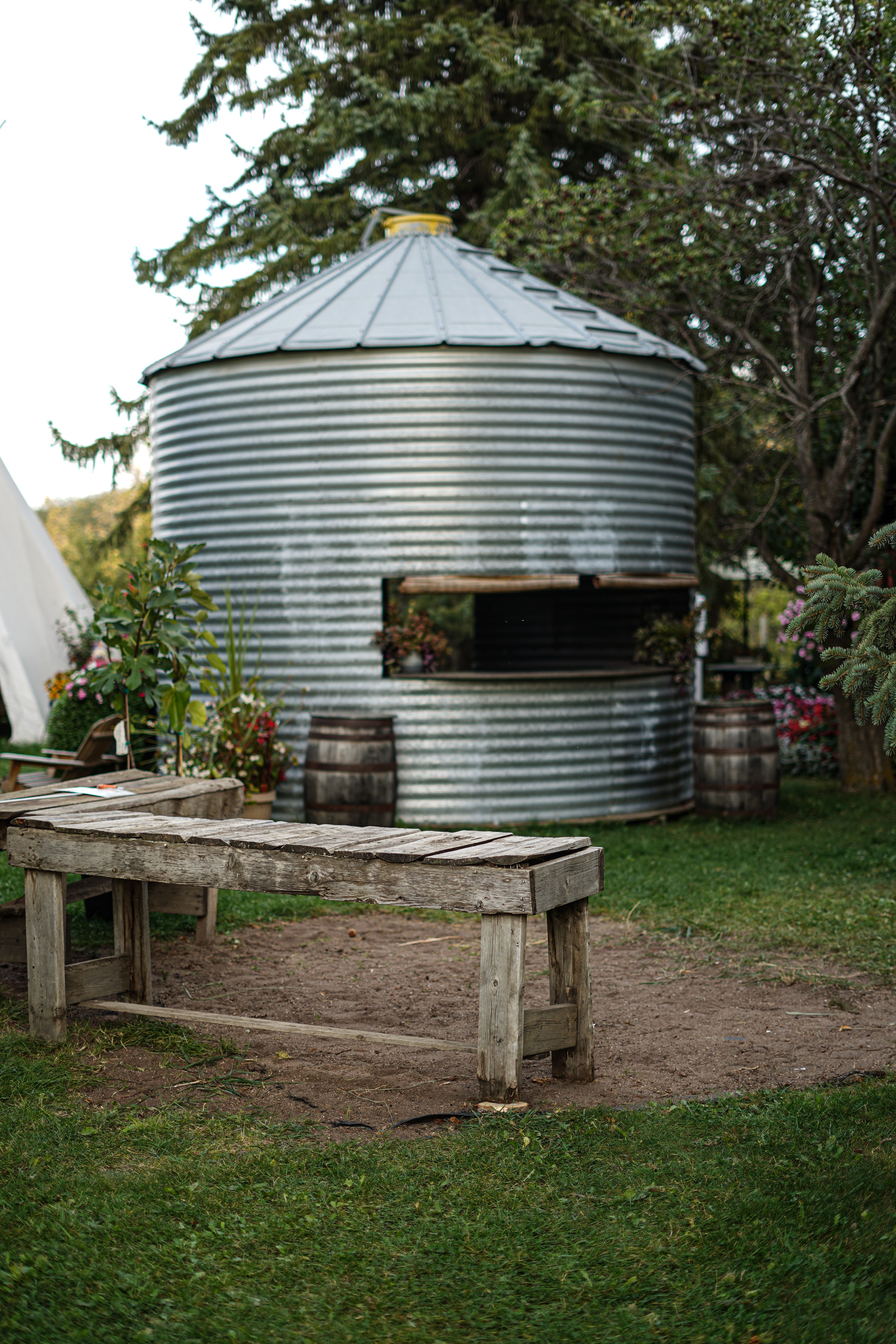 Rustic Farm Setting with Metal Silo · Free Stock Photo
