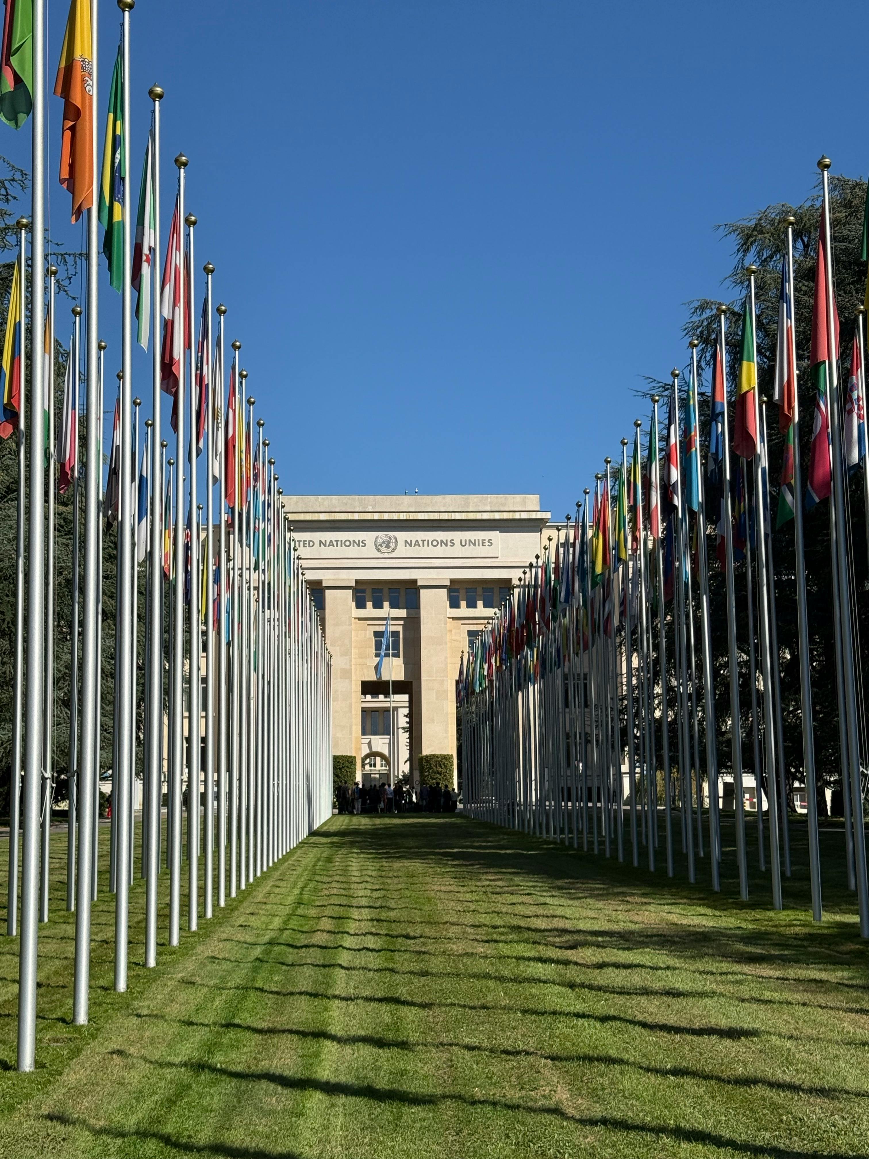 United Nations Building in Geneva with Flags Displayed · Free Stock Photo