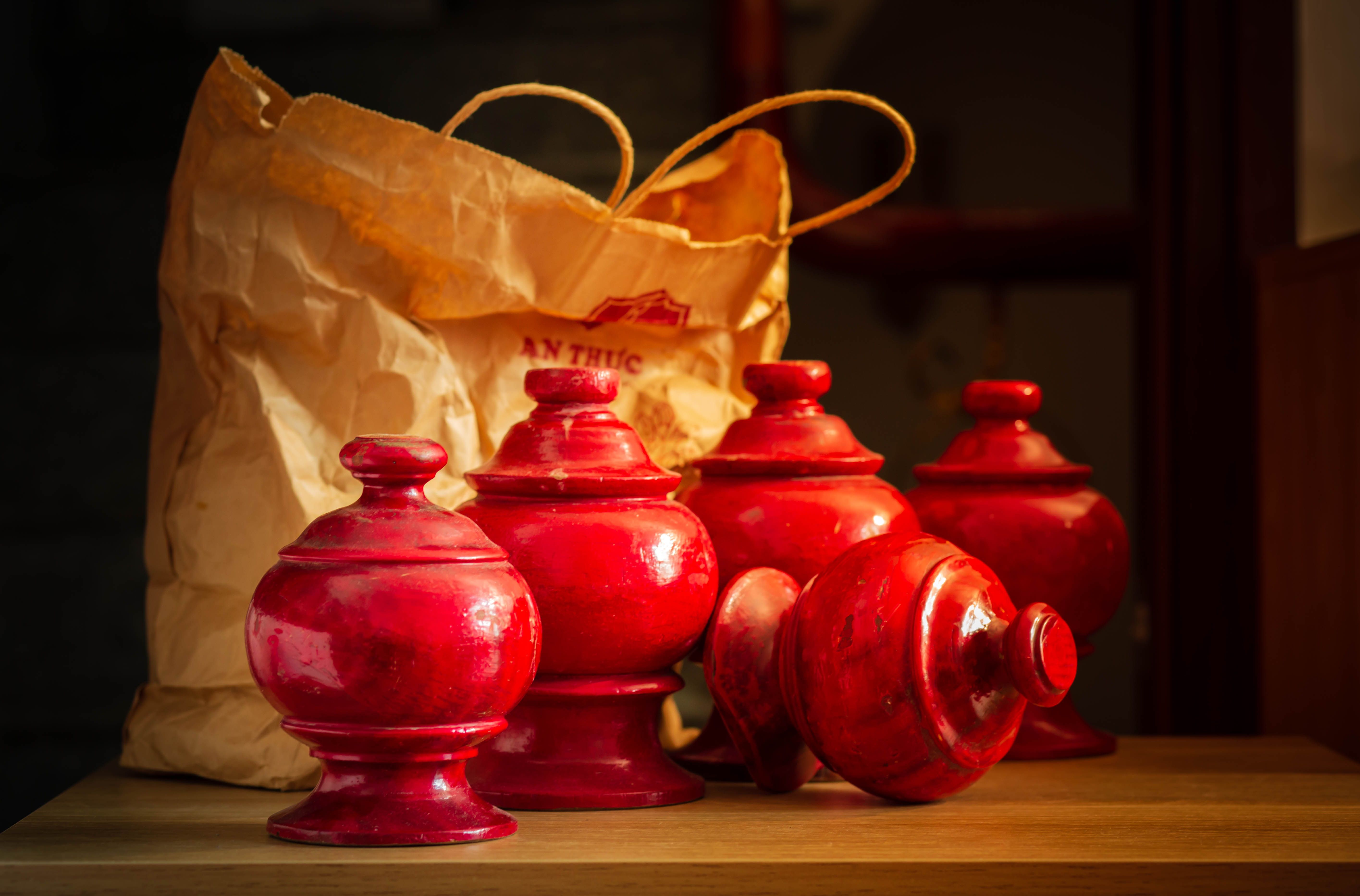 Rustic Red Jars with Brown Paper Bag Indoors · Free Stock Photo