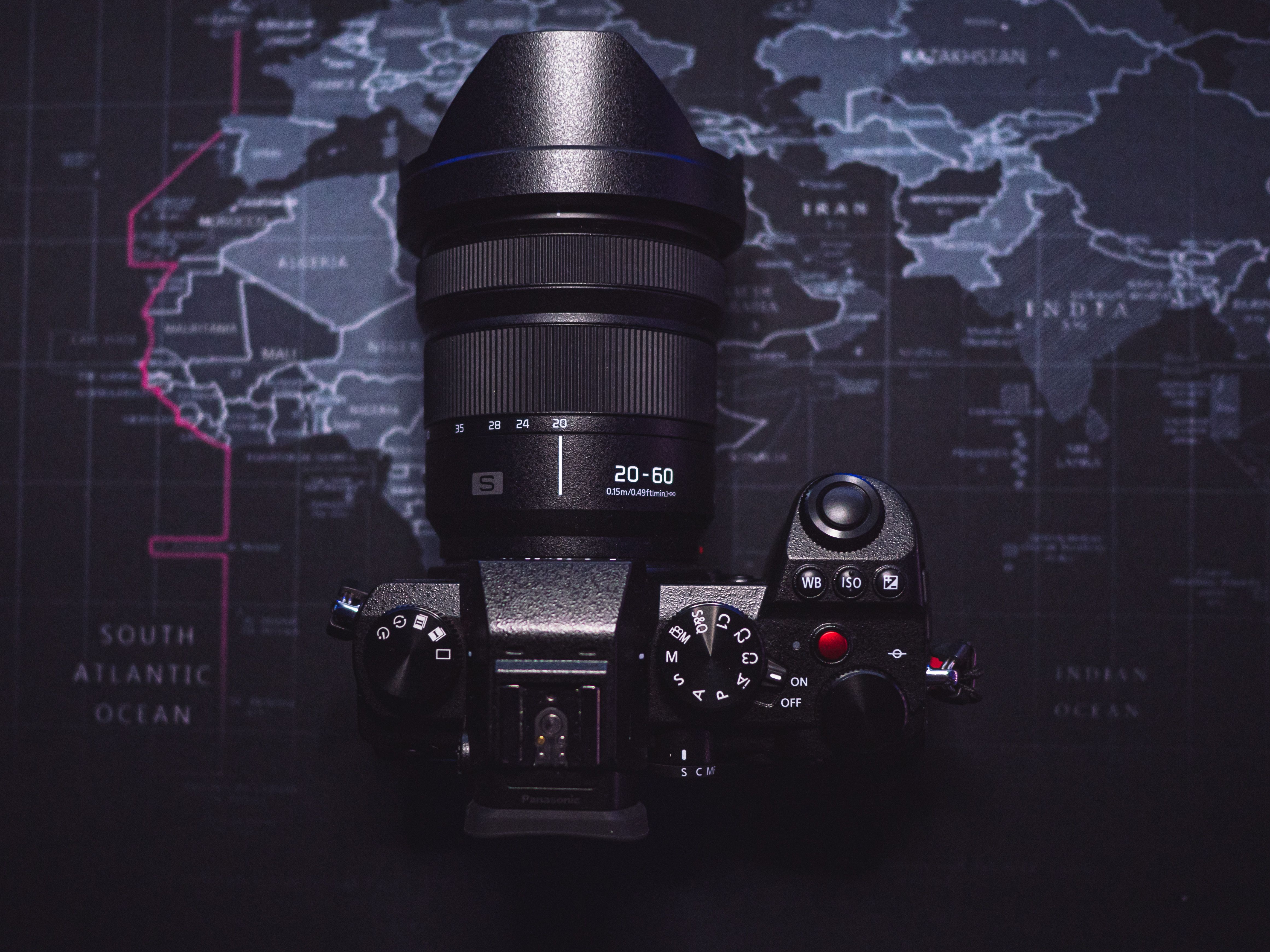 Top-Down View of Camera on World Map Background · Free Stock Photo