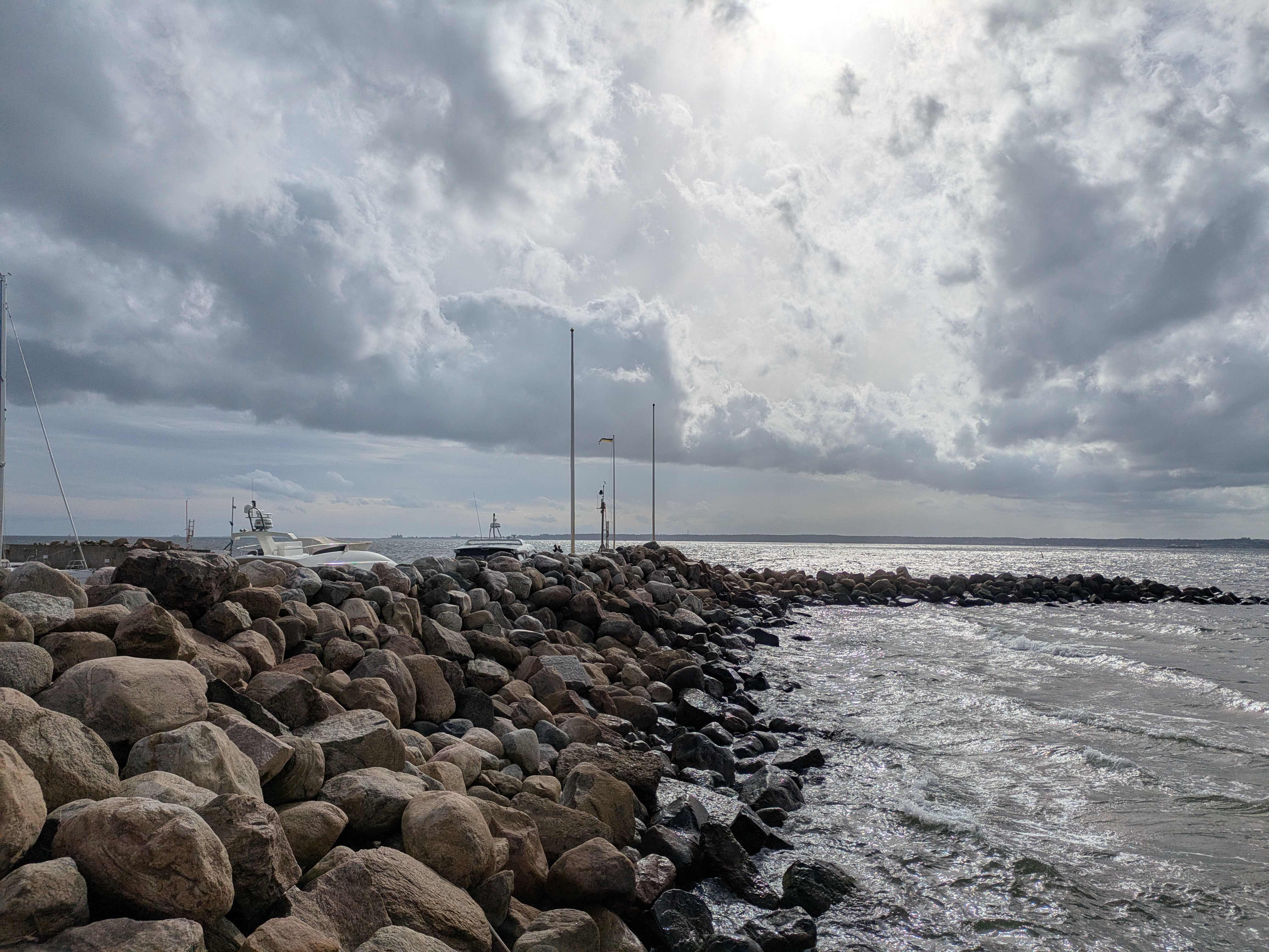Dramatic Coastal Scene with Rocky Breakwater · Free Stock Photo