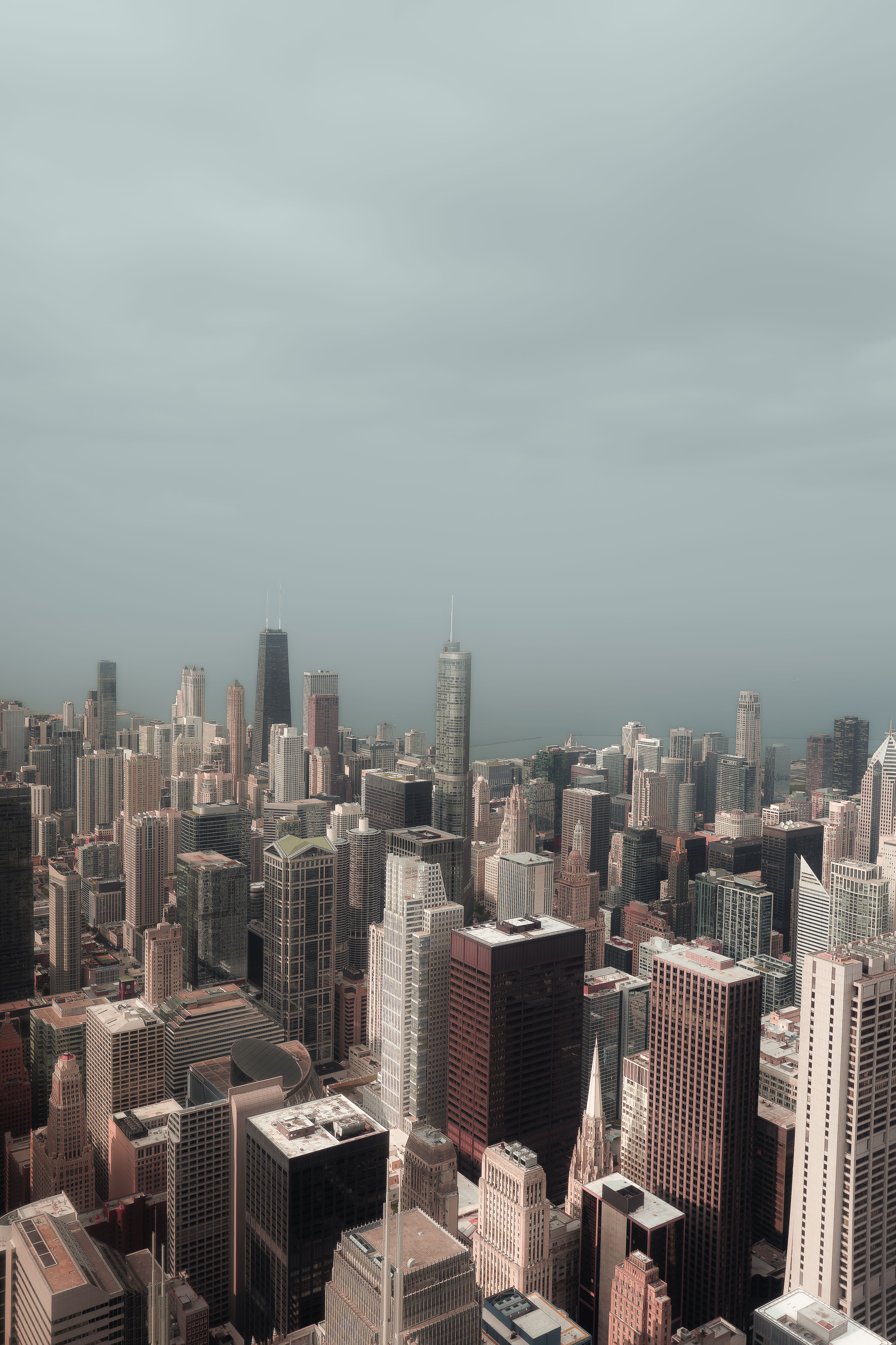 Aerial View of Chicago Skyline under Cloudy Skies · Free Stock Photo