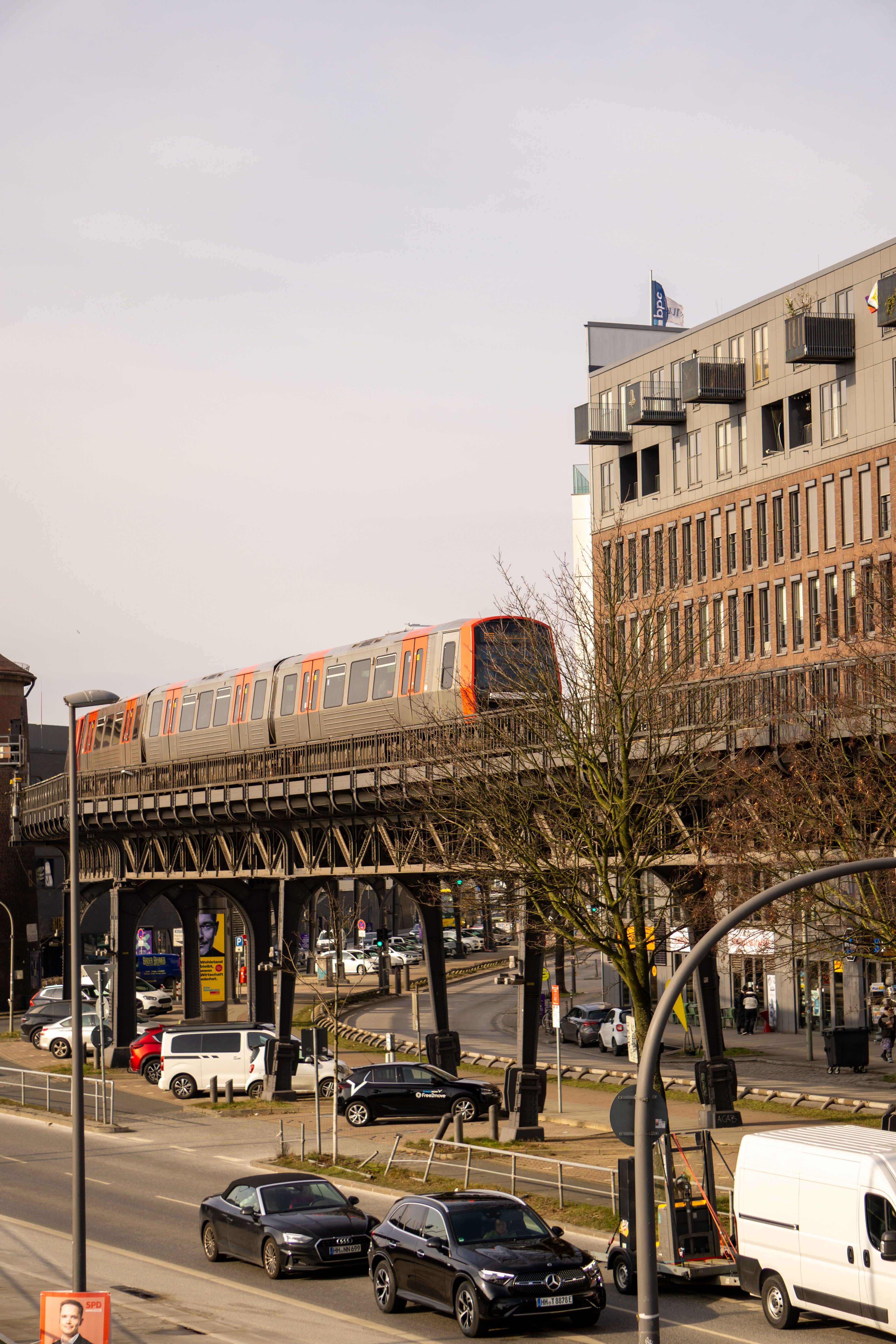 Elevated Train Passing Through Hamburg Cityscape · Free Stock Photo