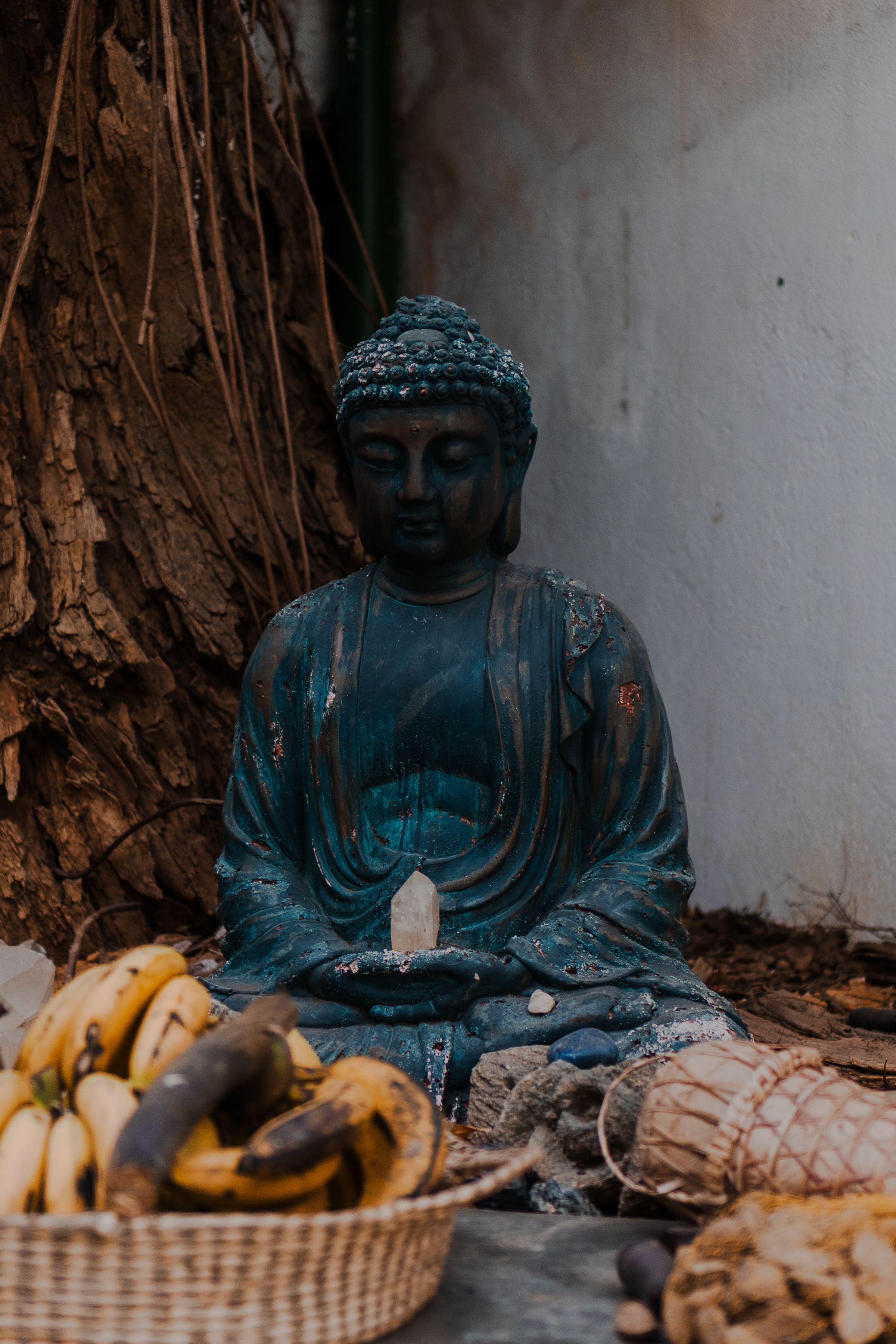 Serene Buddha Statue with Offering Basket · Free Stock Photo