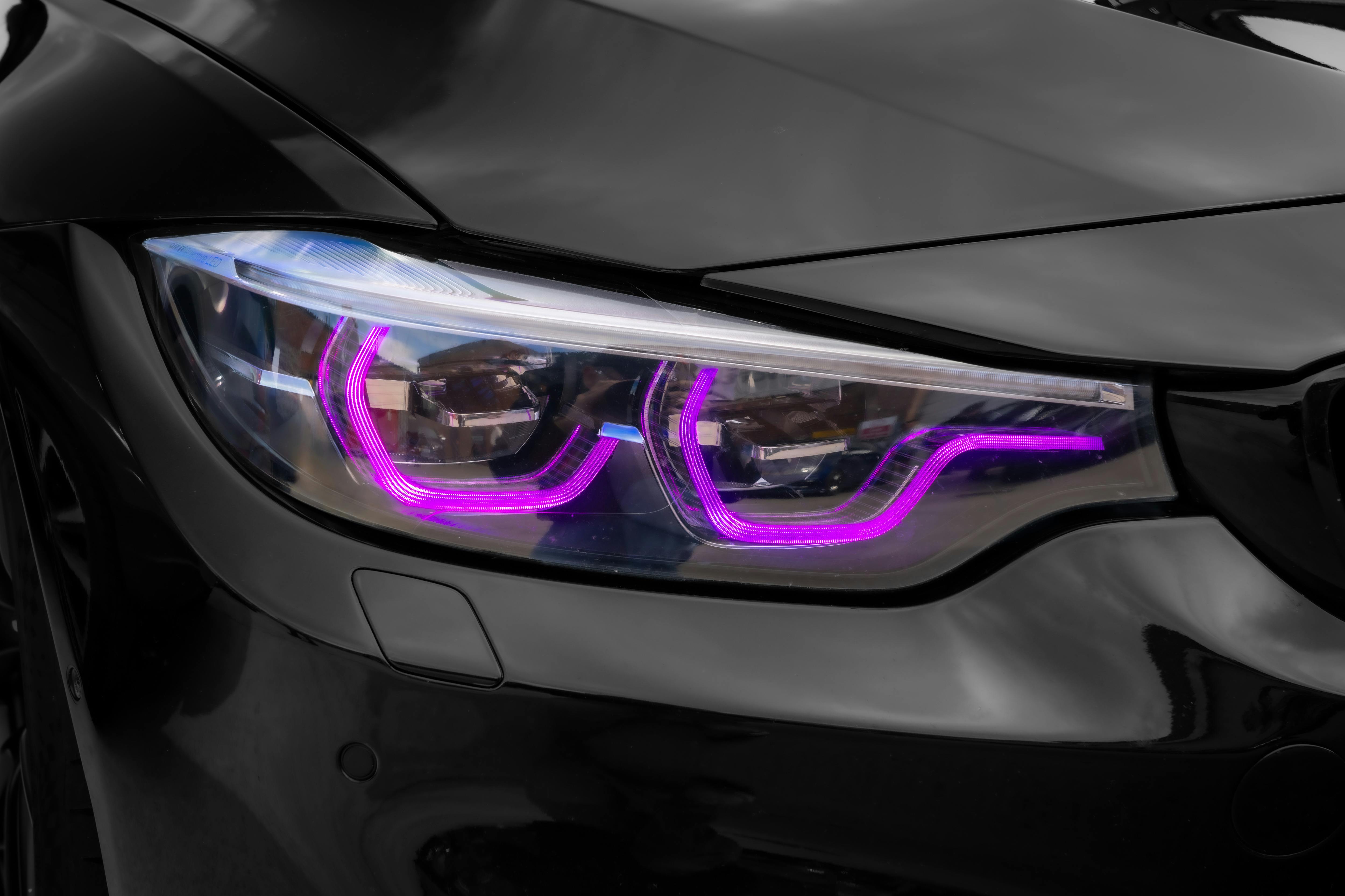 Close-Up of Car Headlight with Purple LED Rings · Free Stock Photo