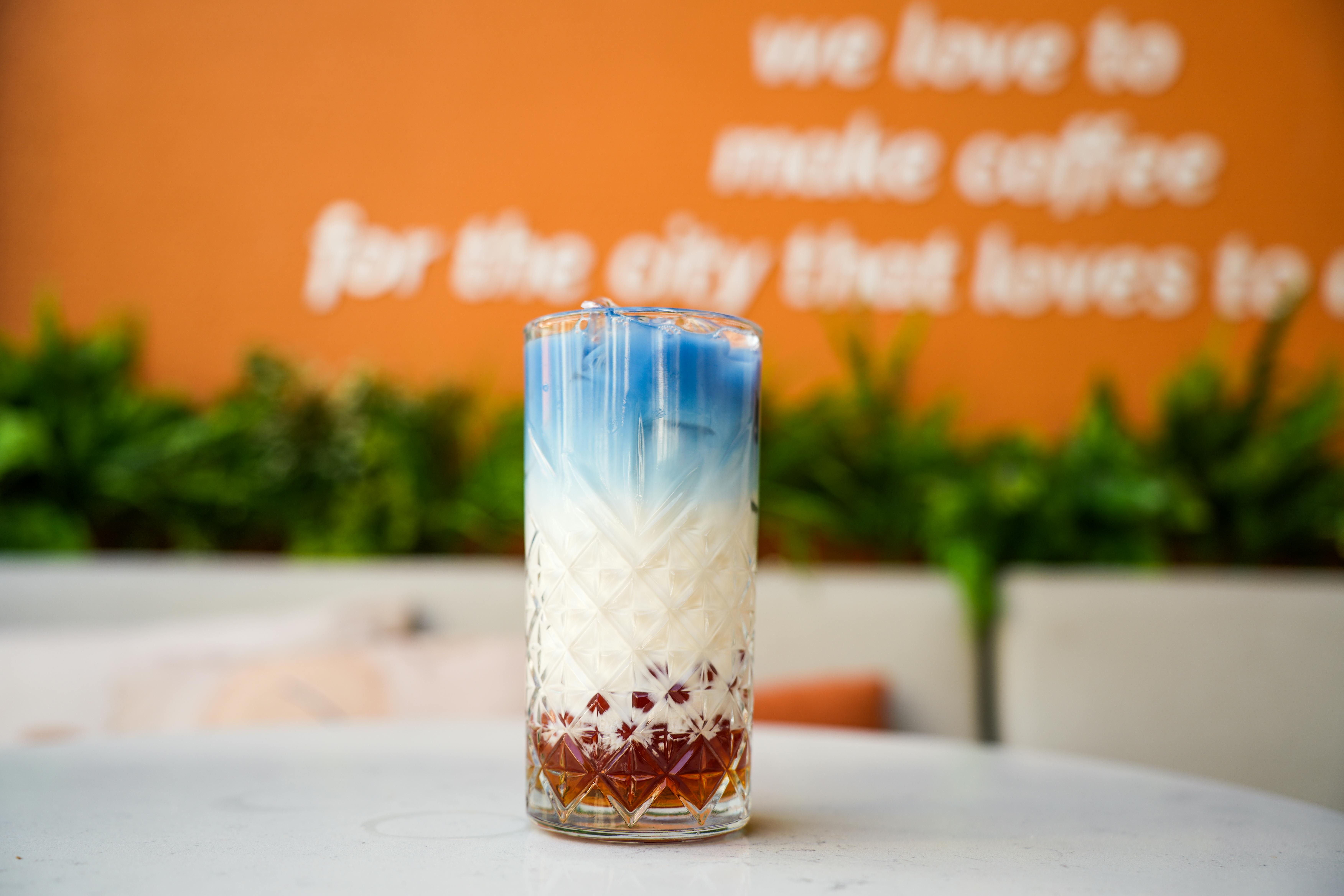 Refreshing Layered Iced Coffee Drink on a Table · Free Stock Photo