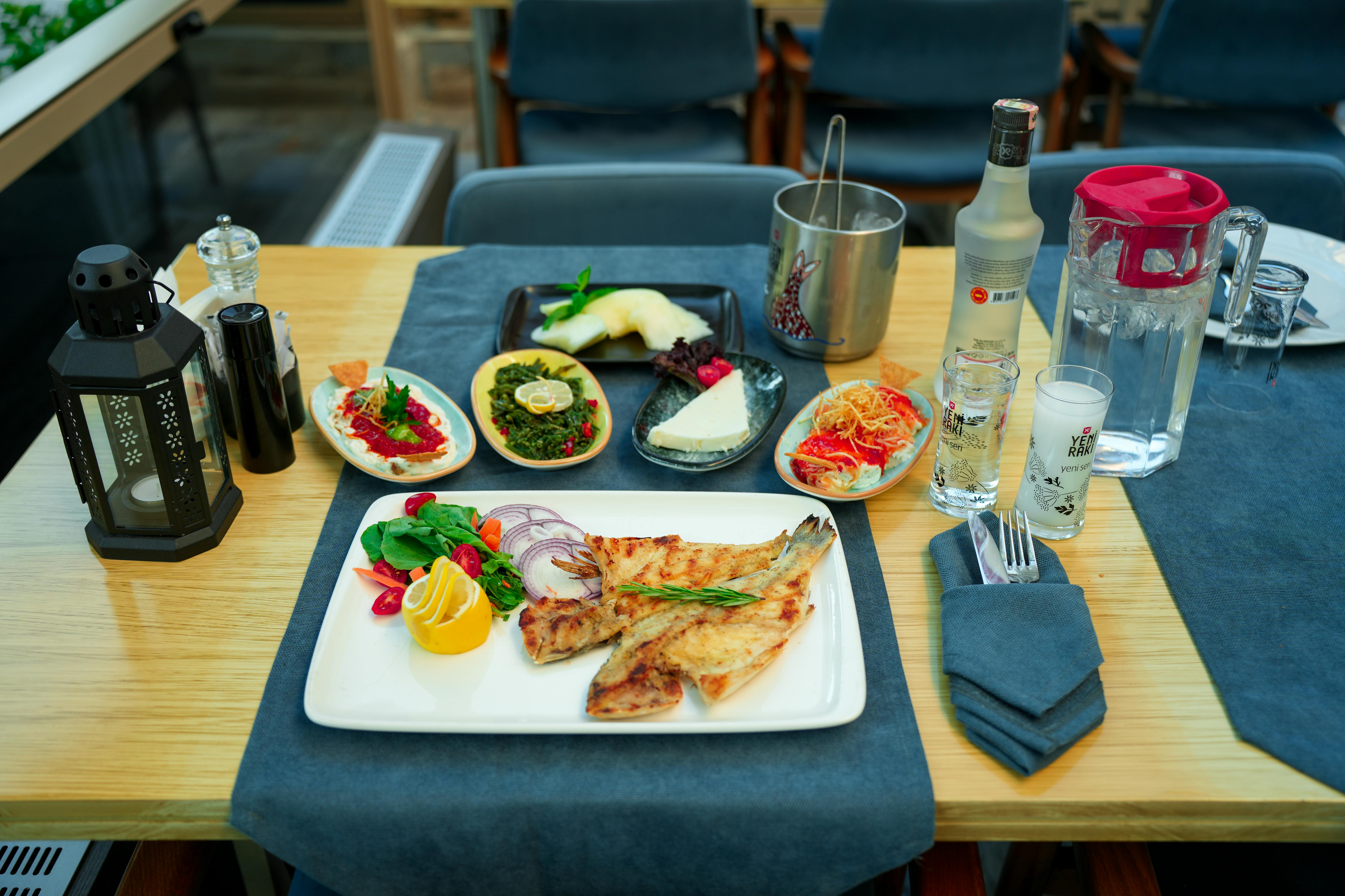 Gourmet Seafood and Appetizers on Restaurant Table · Free Stock Photo