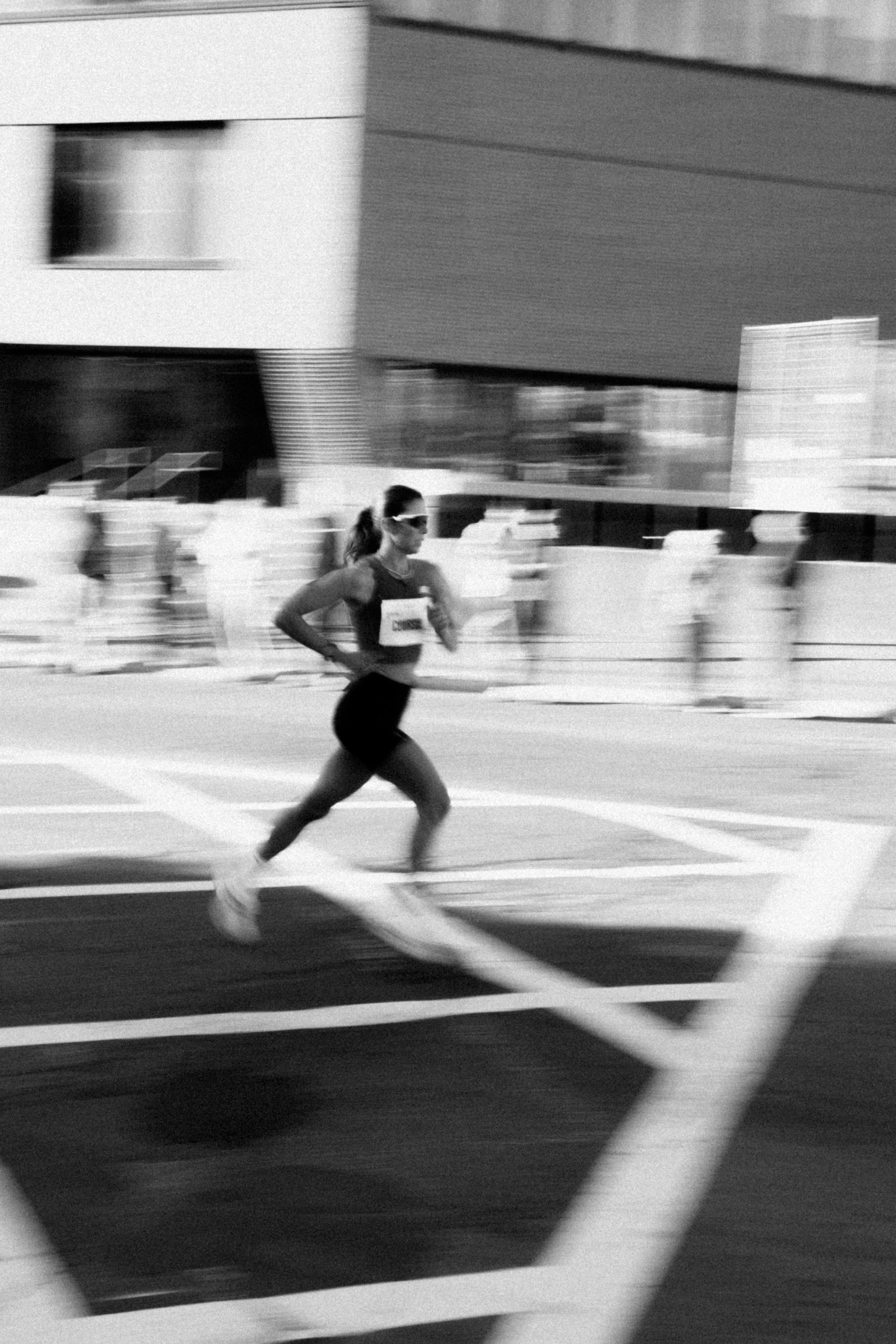 Dynamic Black and White Marathon Runner in Motion · Free Stock Photo