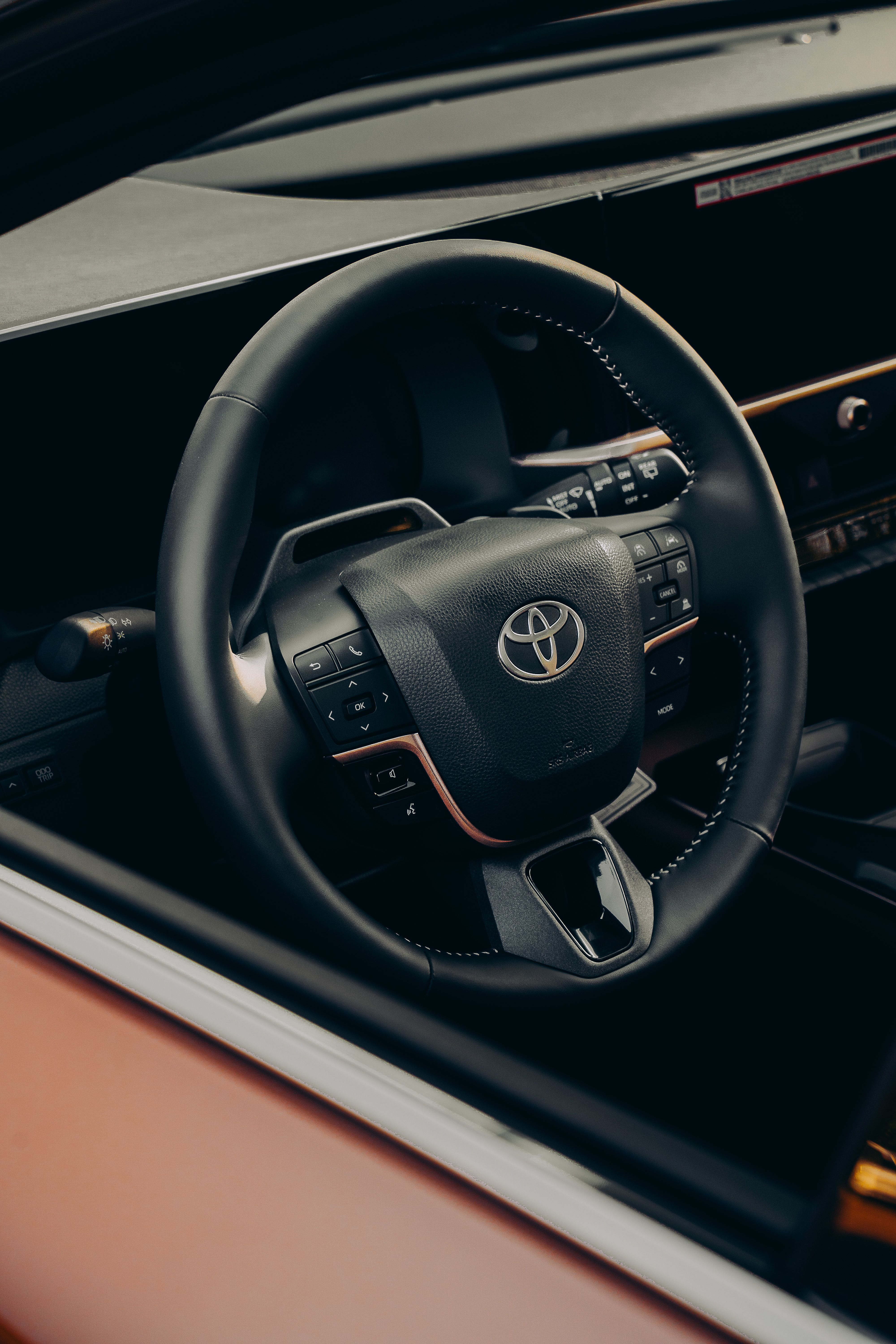 Close-Up of Car Steering Wheel in Modern Vehicle · Free Stock Photo