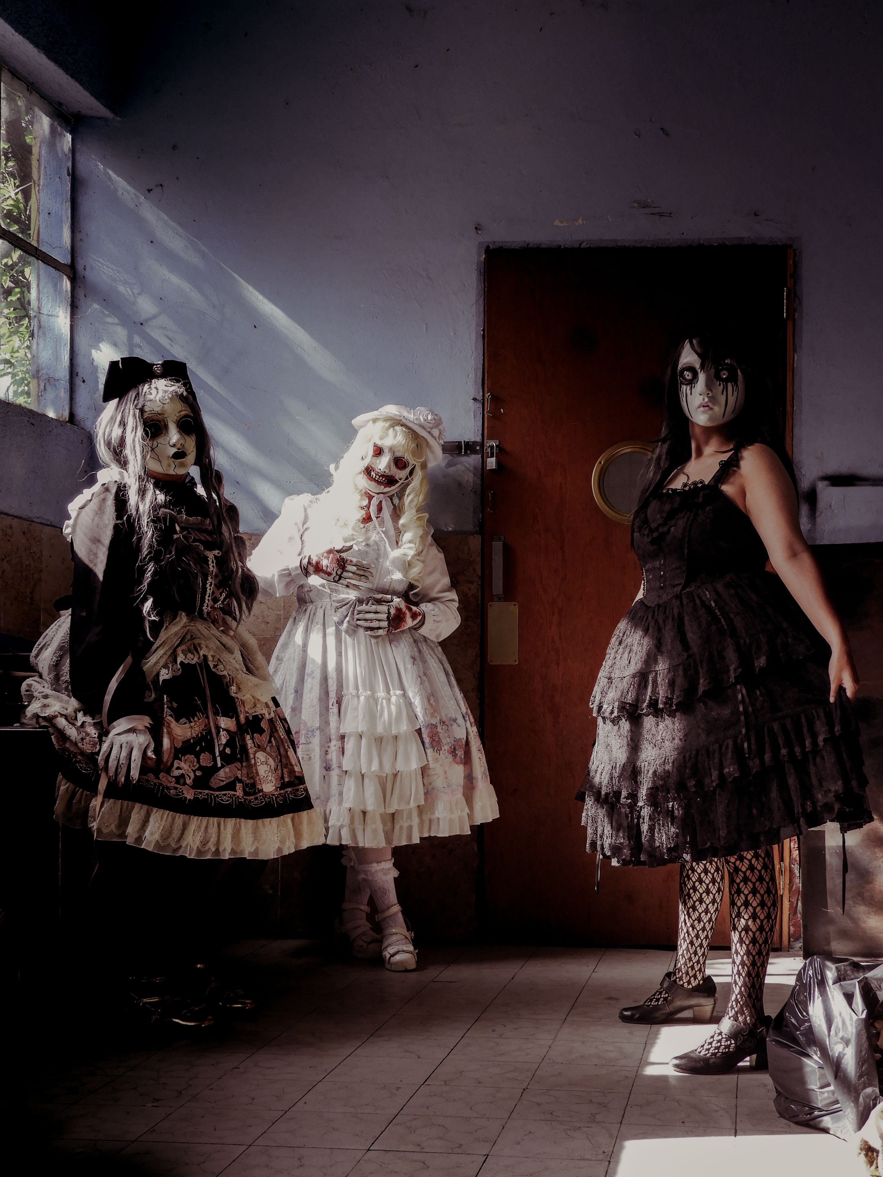 Spooky Doll Costumes in Haunted Setting · Free Stock Photo