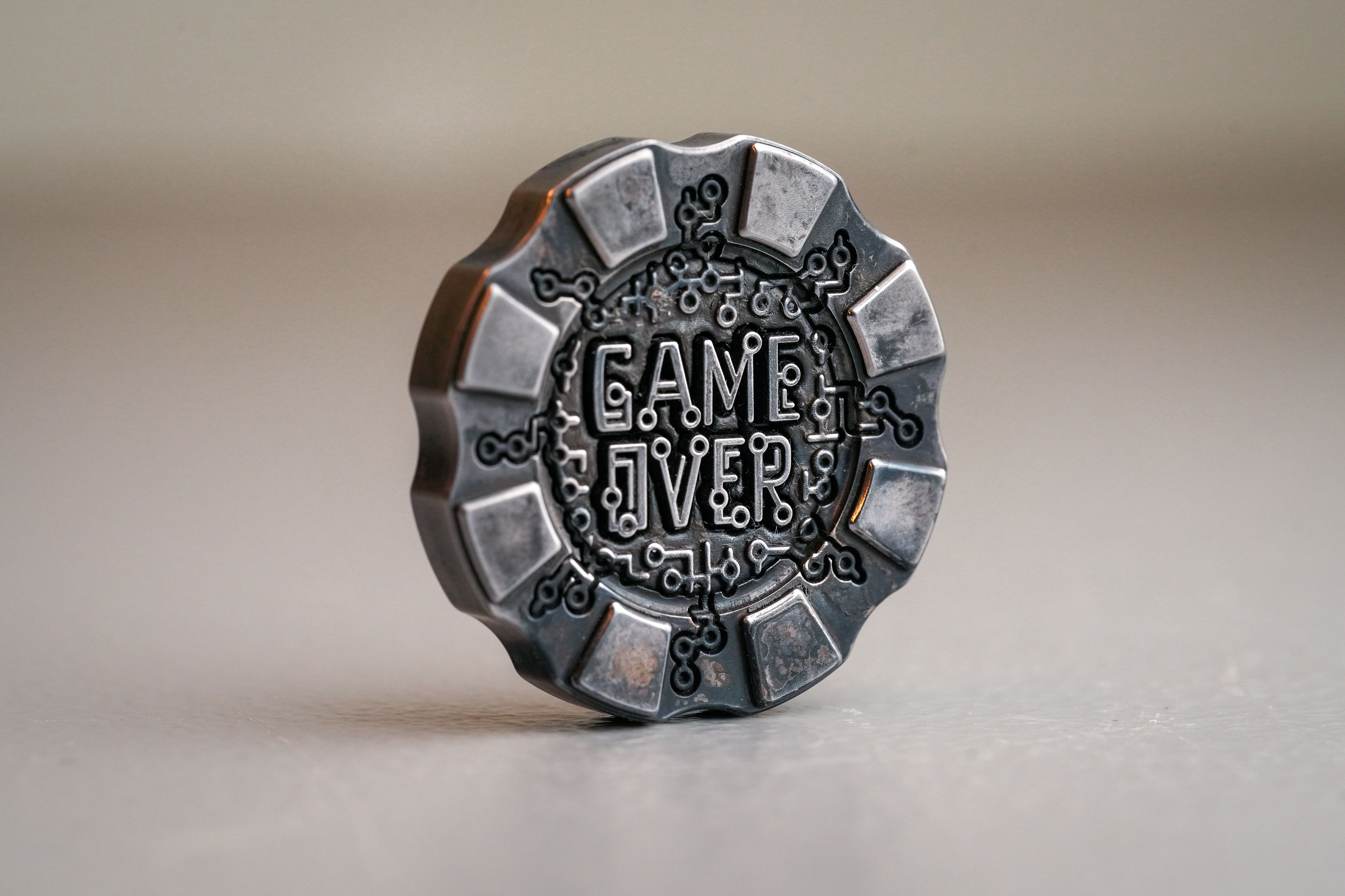 Close-Up of Metal Coin with 'Game Over' Text · Free Stock Photo