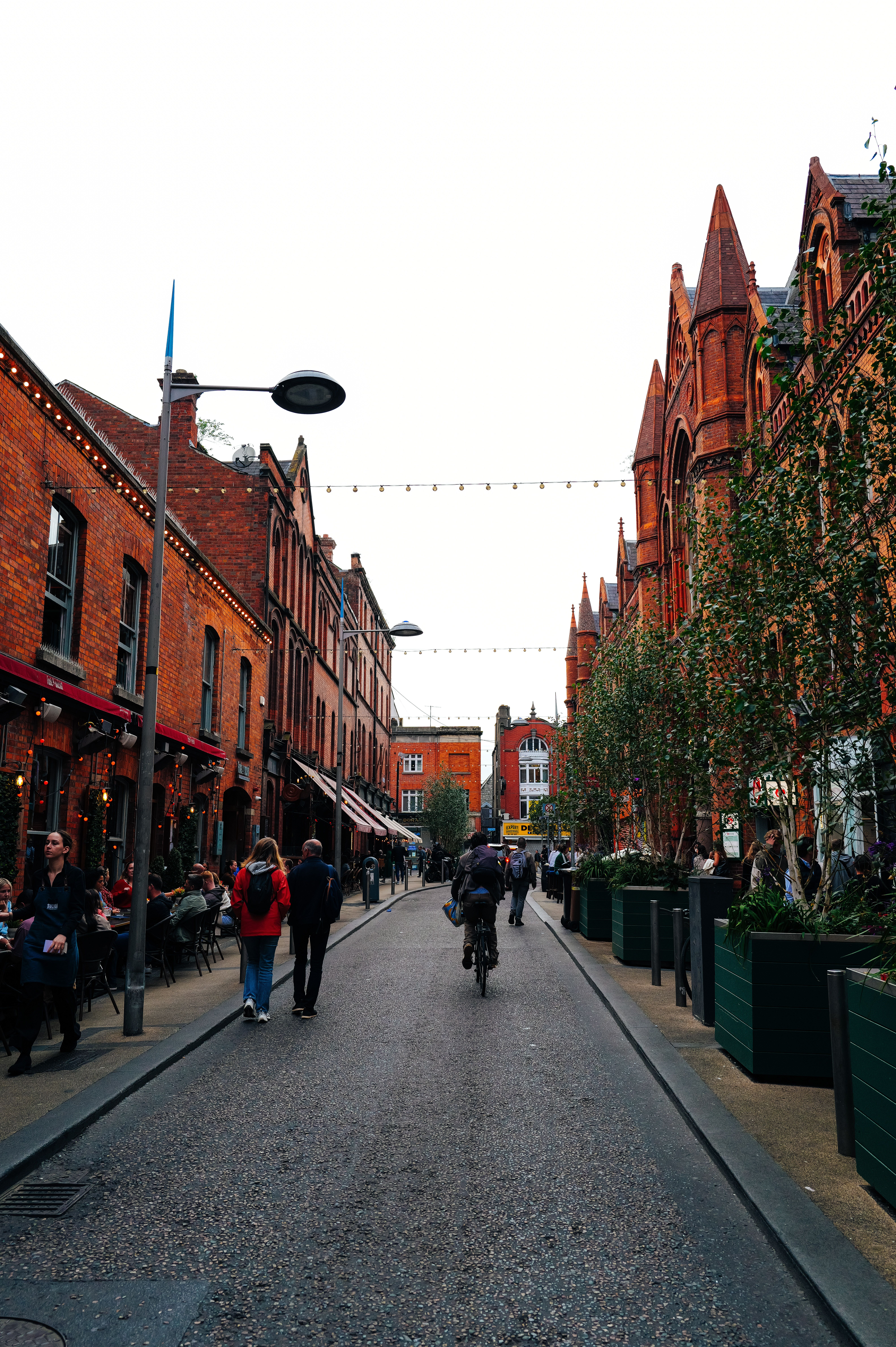Vibrant European Street Scene with Red Brick Architecture · Free Stock ...