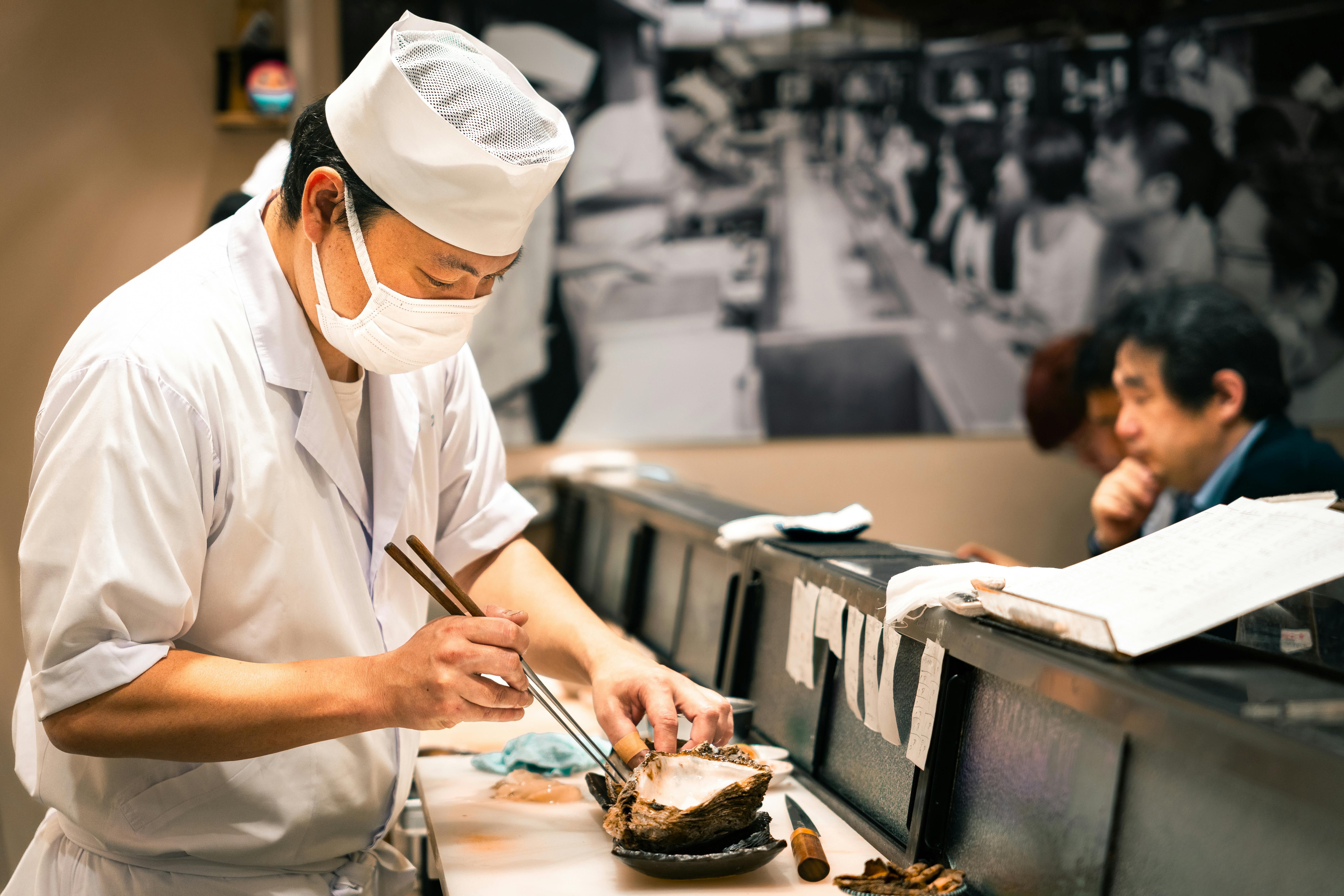 Skilled Sushi Chef at Work in Tokyo Restaurant · Free Stock Photo