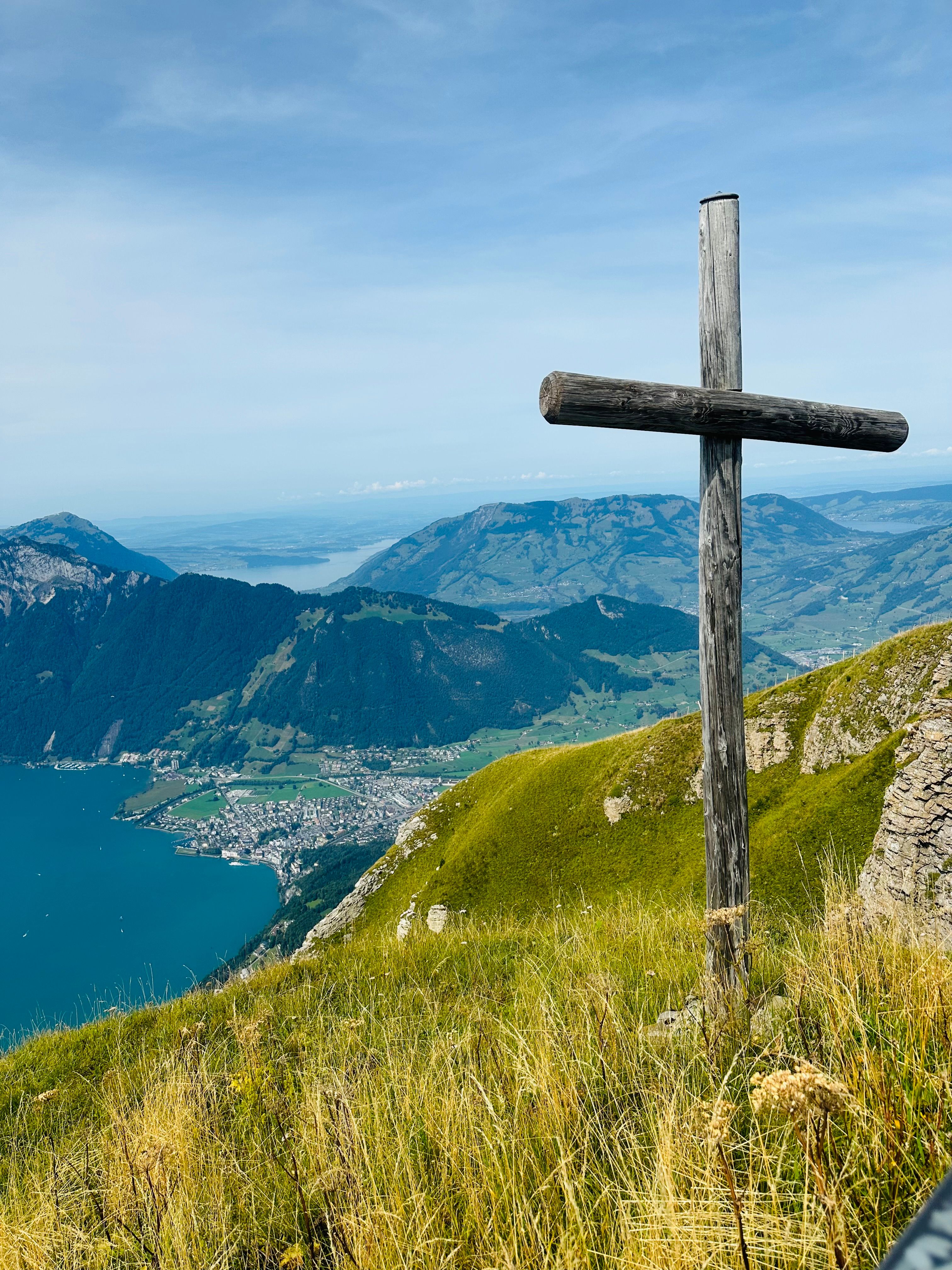Scenic Mountain View with Wooden Cross Overlooking Lake · Free Stock Photo