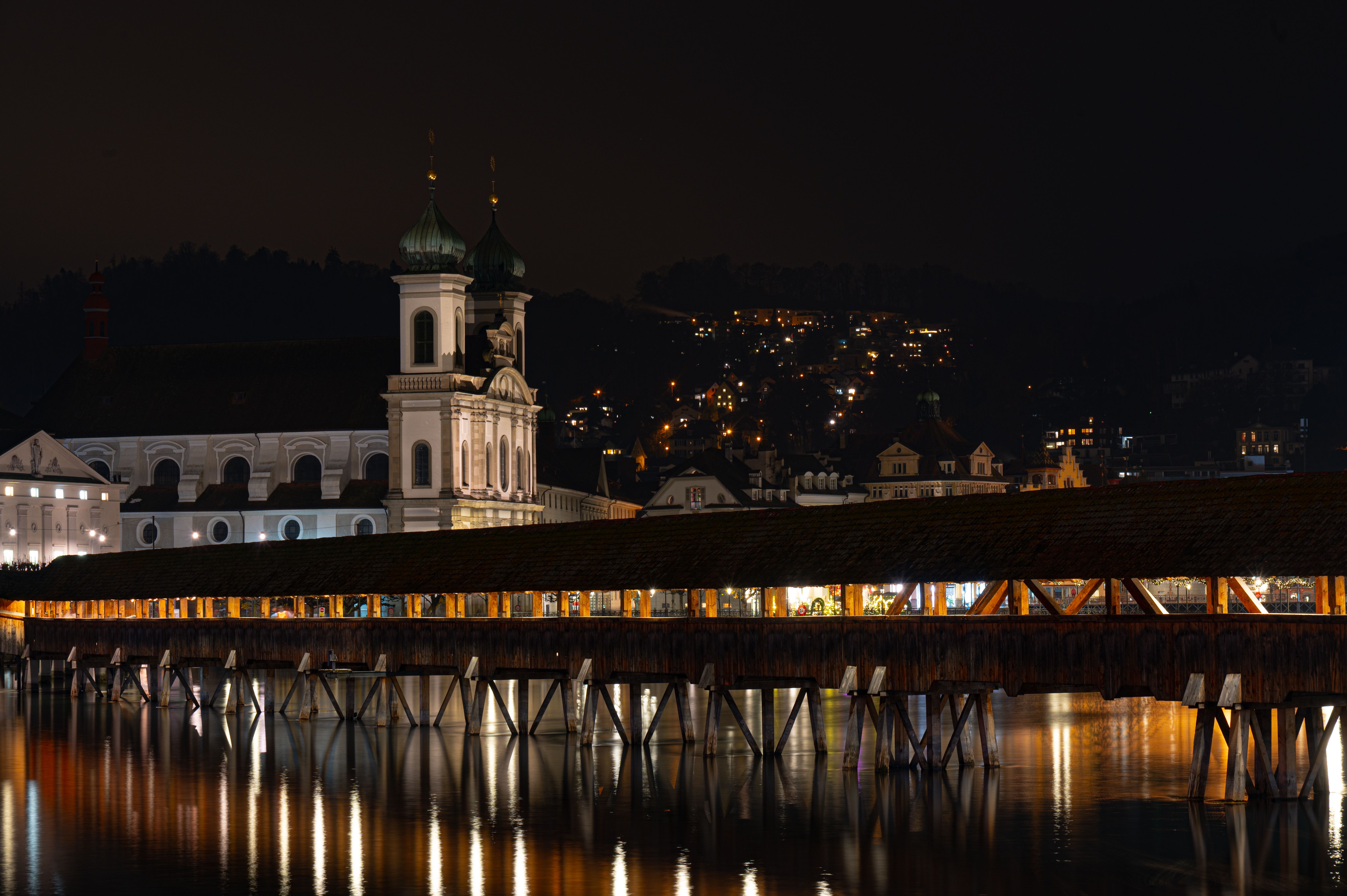 Night View of Chapel Bridge and Jesuit Church in Lucerne · Free Stock Photo