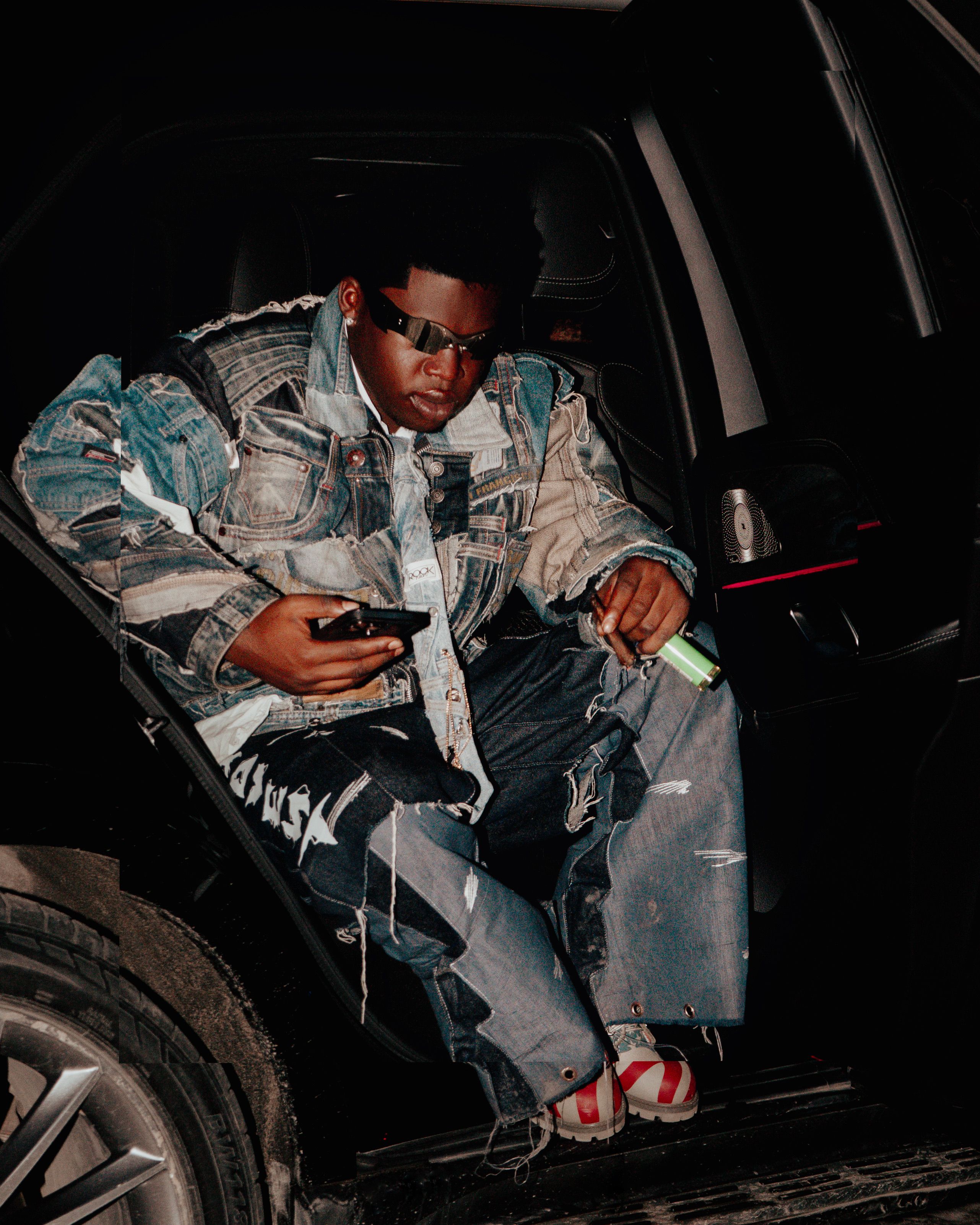 Stylish Man Exiting Car in Denim Fashion · Free Stock Photo
