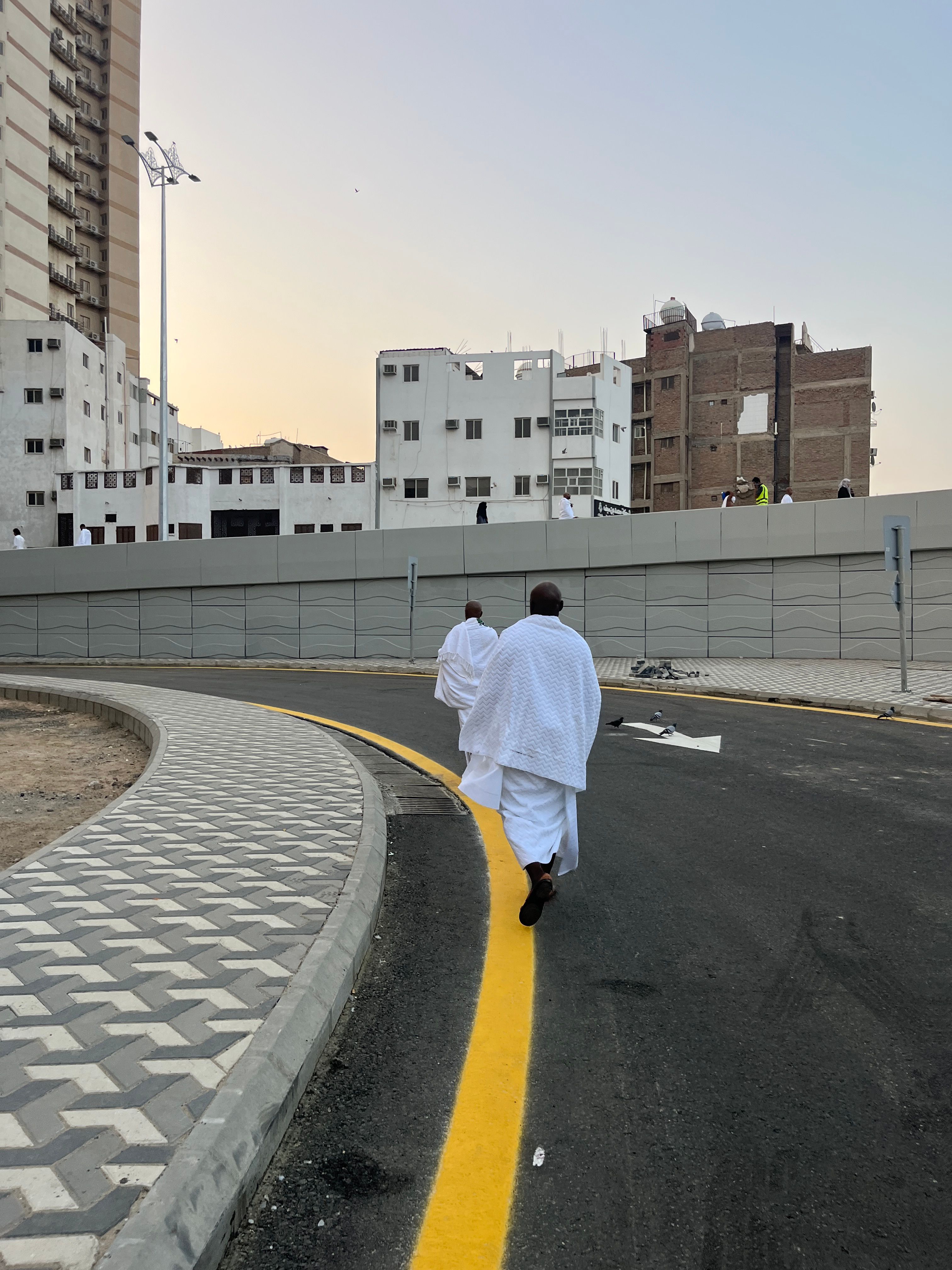 Men Walking in Traditional Islamic Attire on Urban Street · Free Stock ...