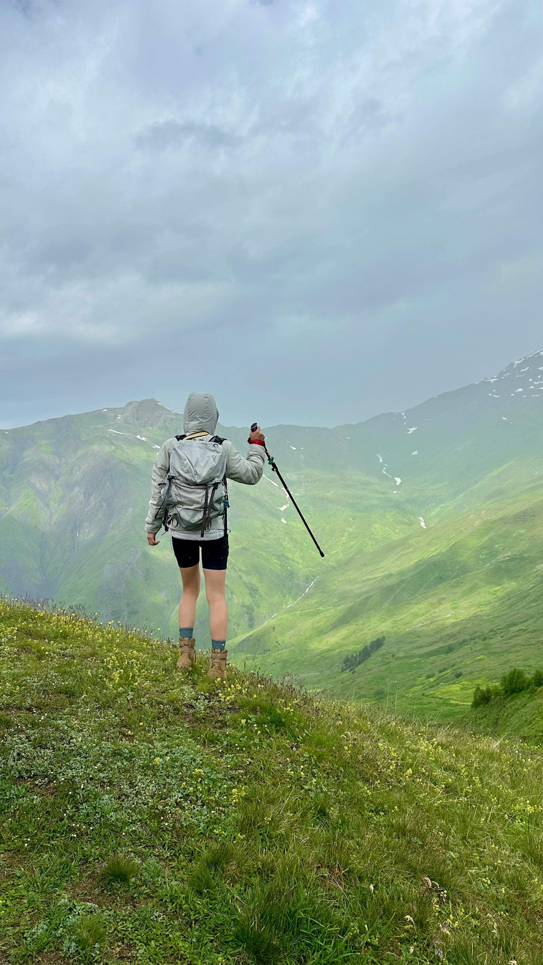 Hiker Exploring Scenic Mountain Ranges · Free Stock Photo