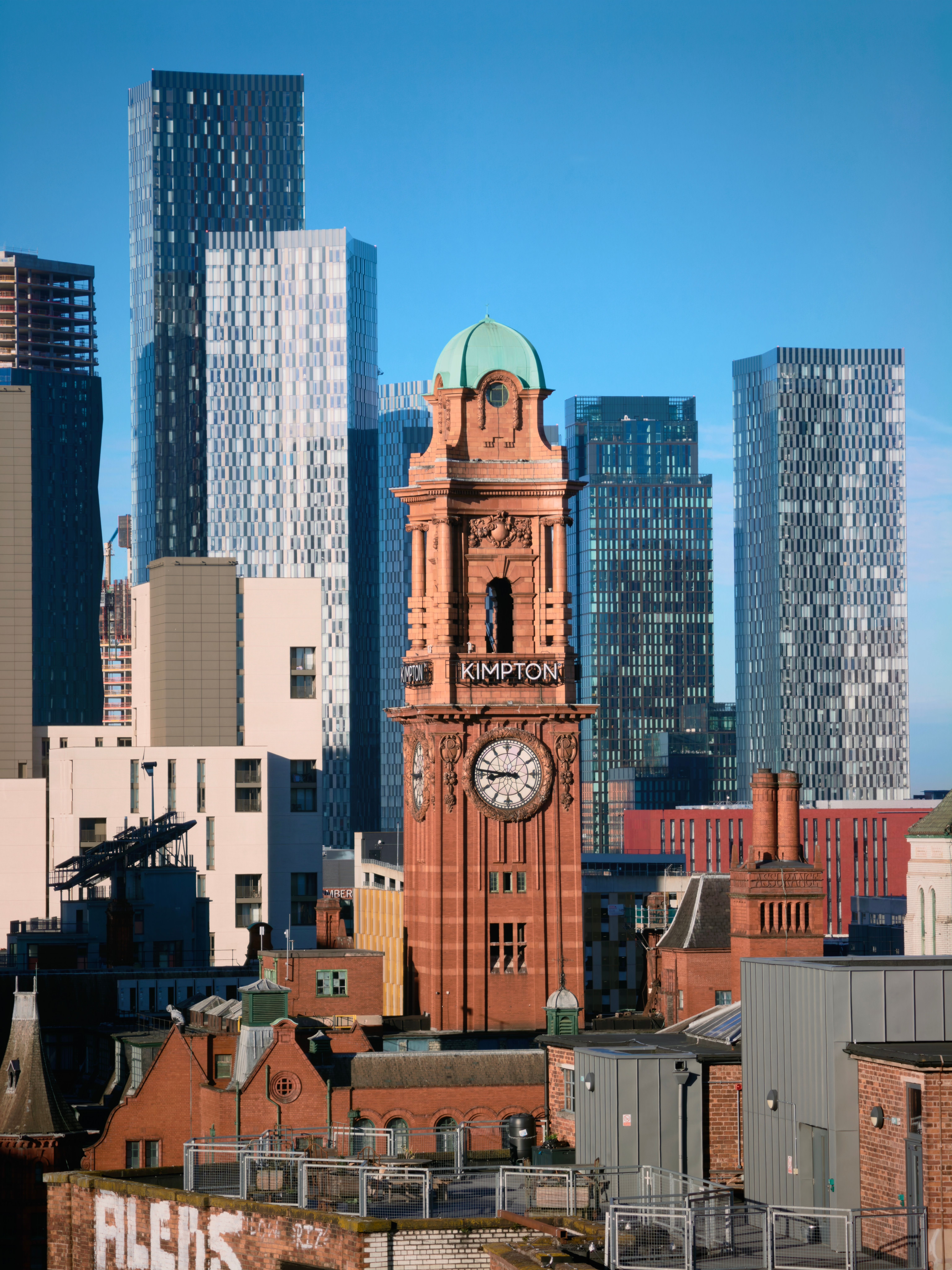 Clock Tower Amidst Modern Skyscrapers in Cityscape · Free Stock Photo