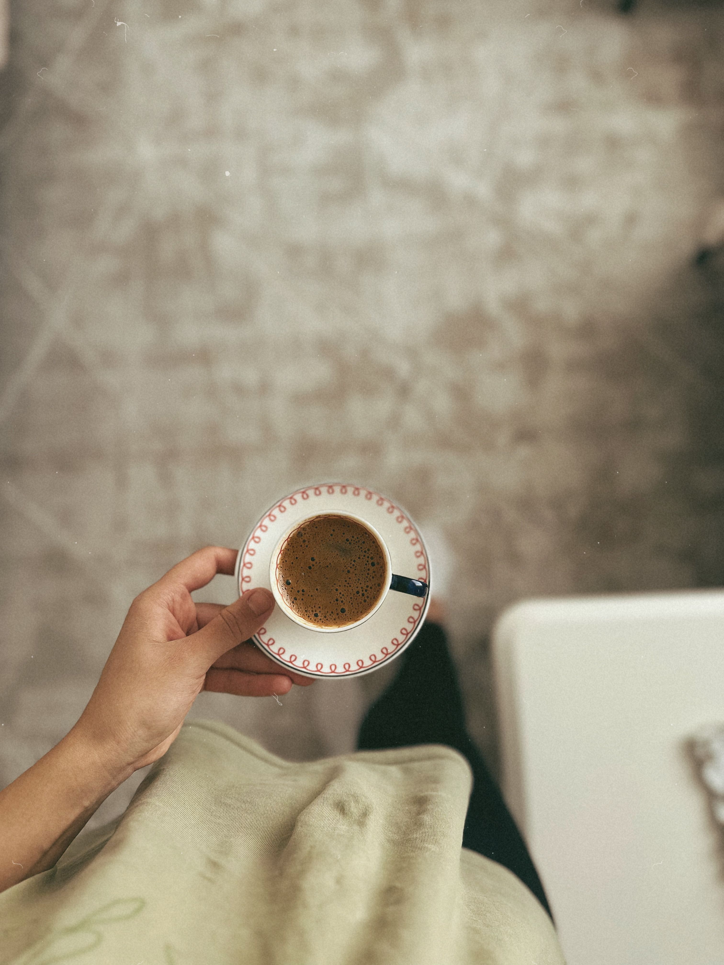 Casual Overhead Shot of Holding Coffee Cup · Free Stock Photo