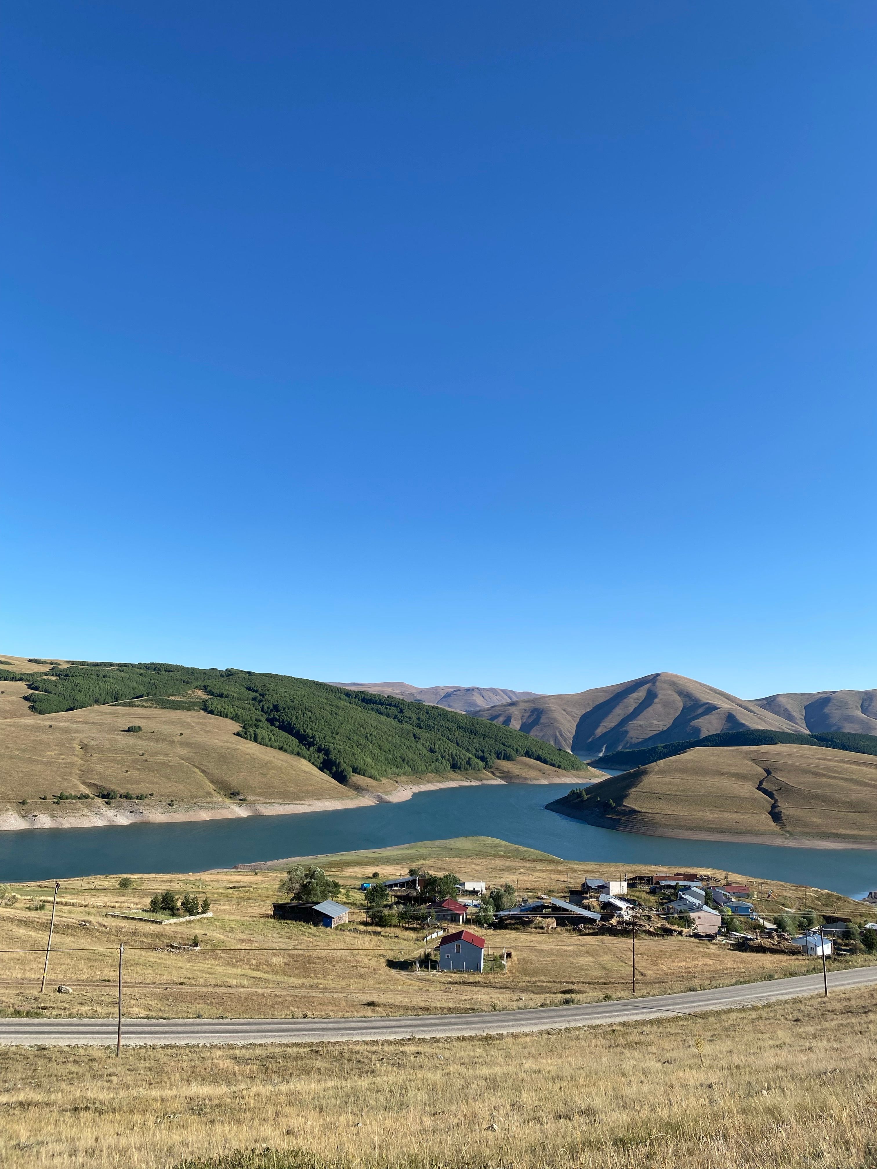 Scenic View of Quaint Village by a Serene Lake · Free Stock Photo