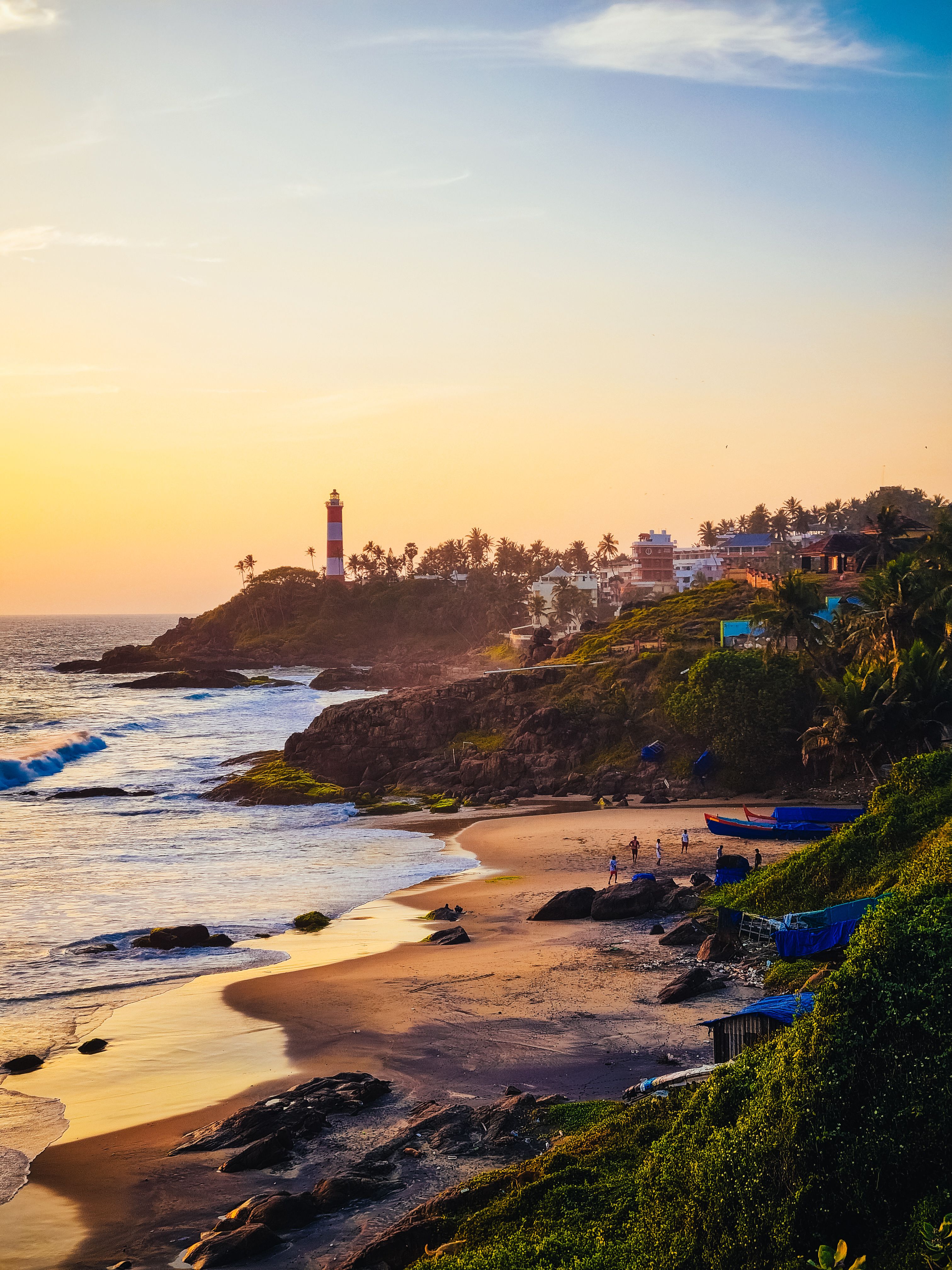 Picturesque Kovalam Beach at Sunset with Lighthouse · Free Stock Photo