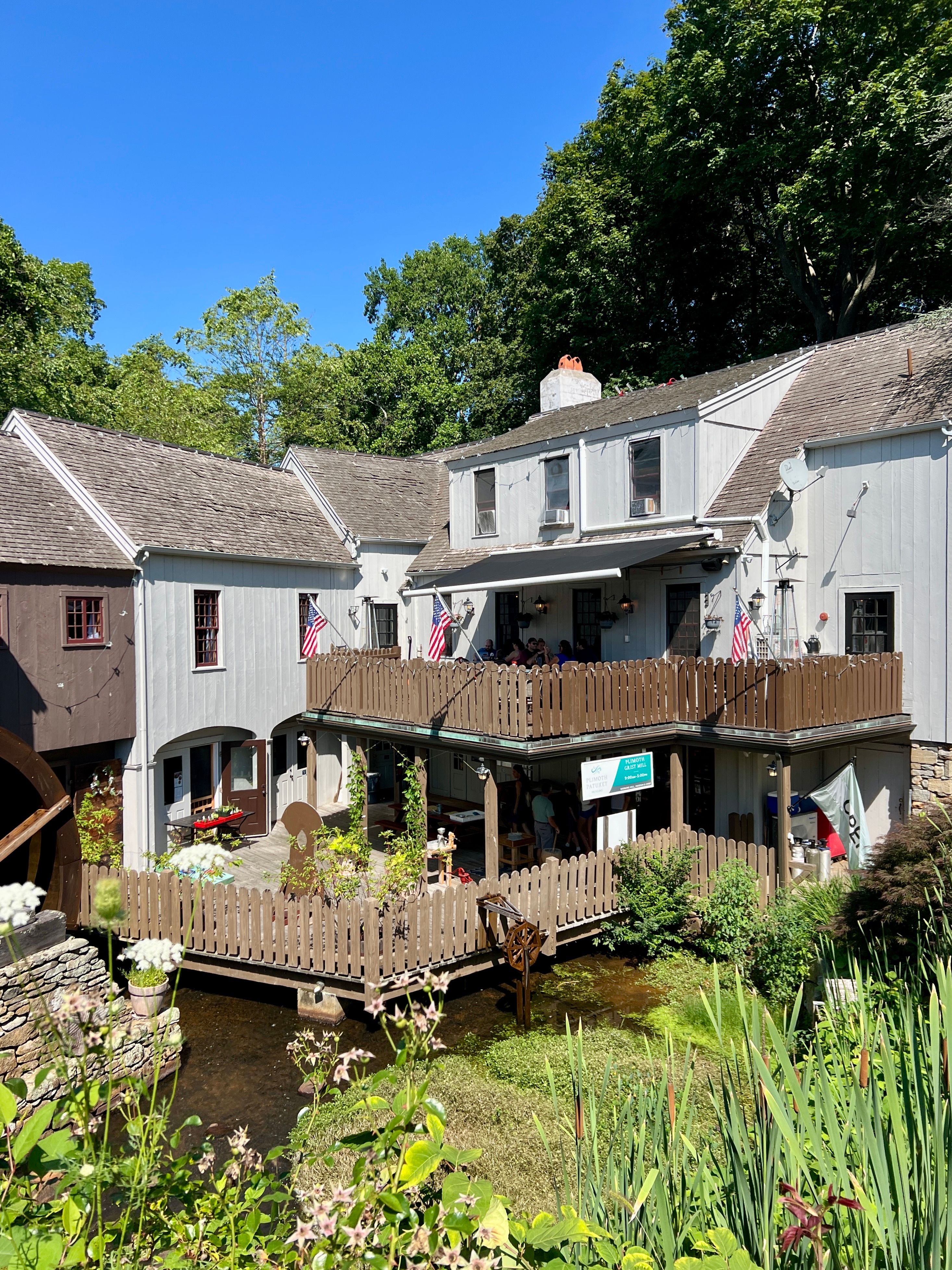 Historic Wooden Mill in Lush Greenery · Free Stock Photo