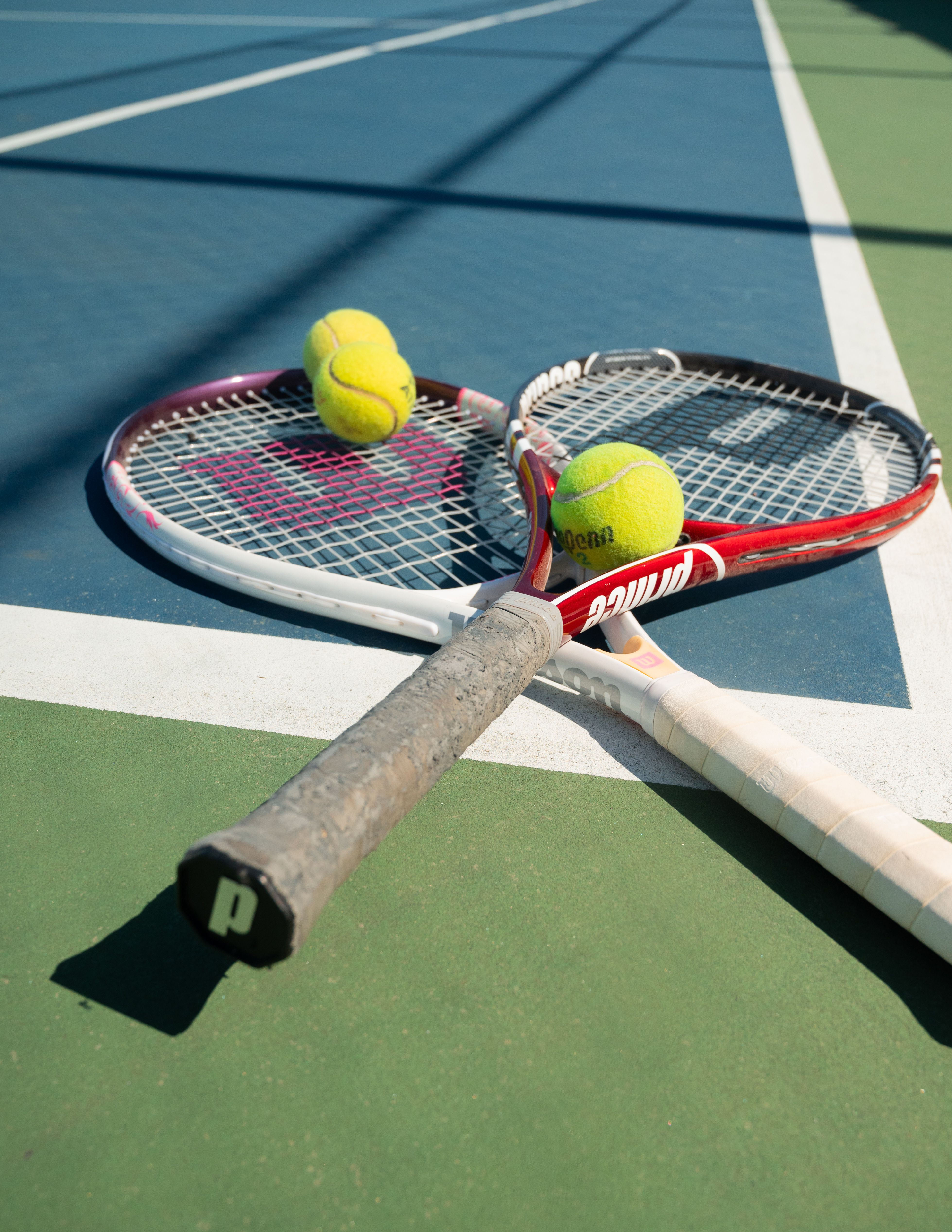 Chair on Tennis Court Next to Racket and Balls · Free Stock Photo