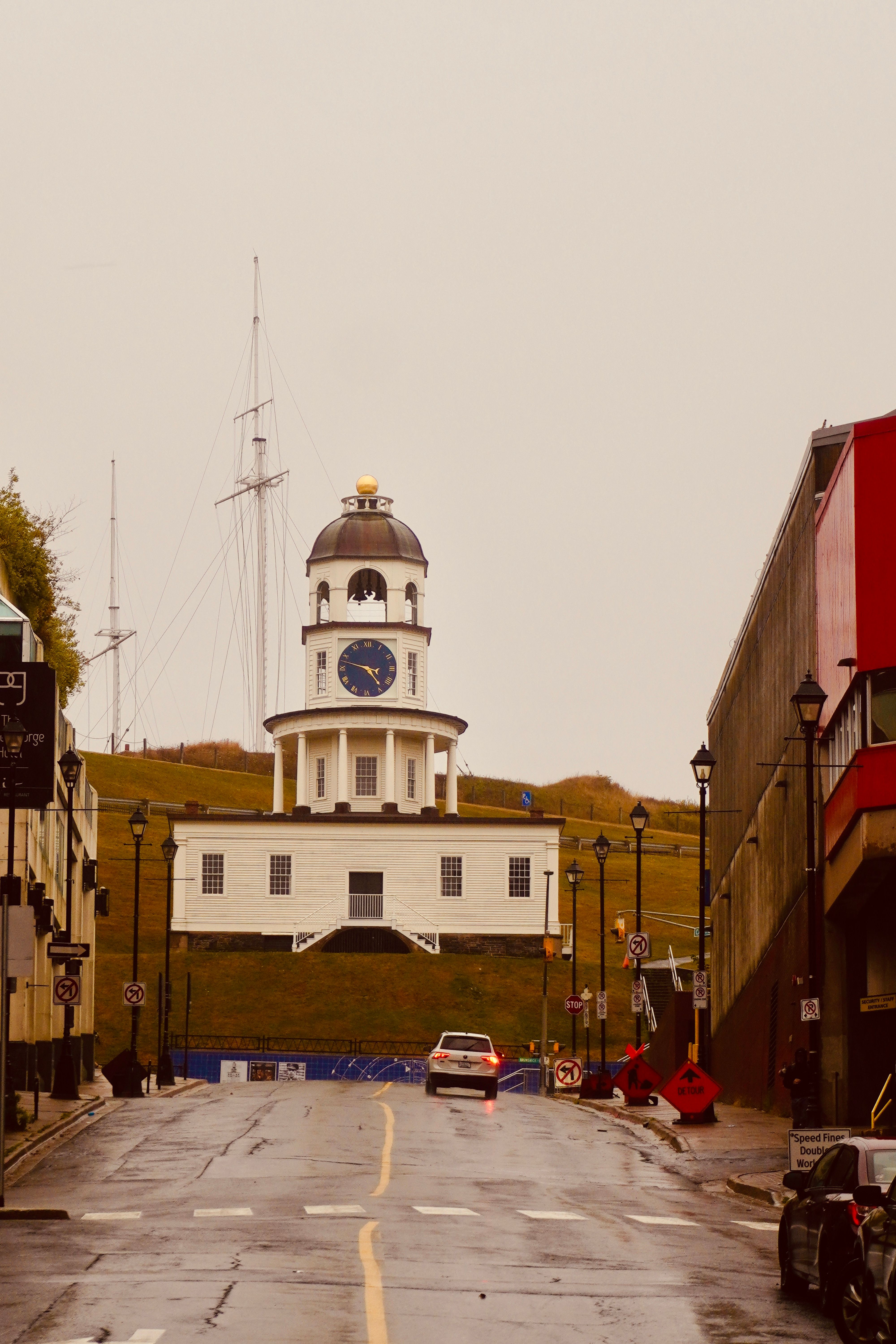 Historic Clock Tower on a Rainy Day Street View · Free Stock Photo