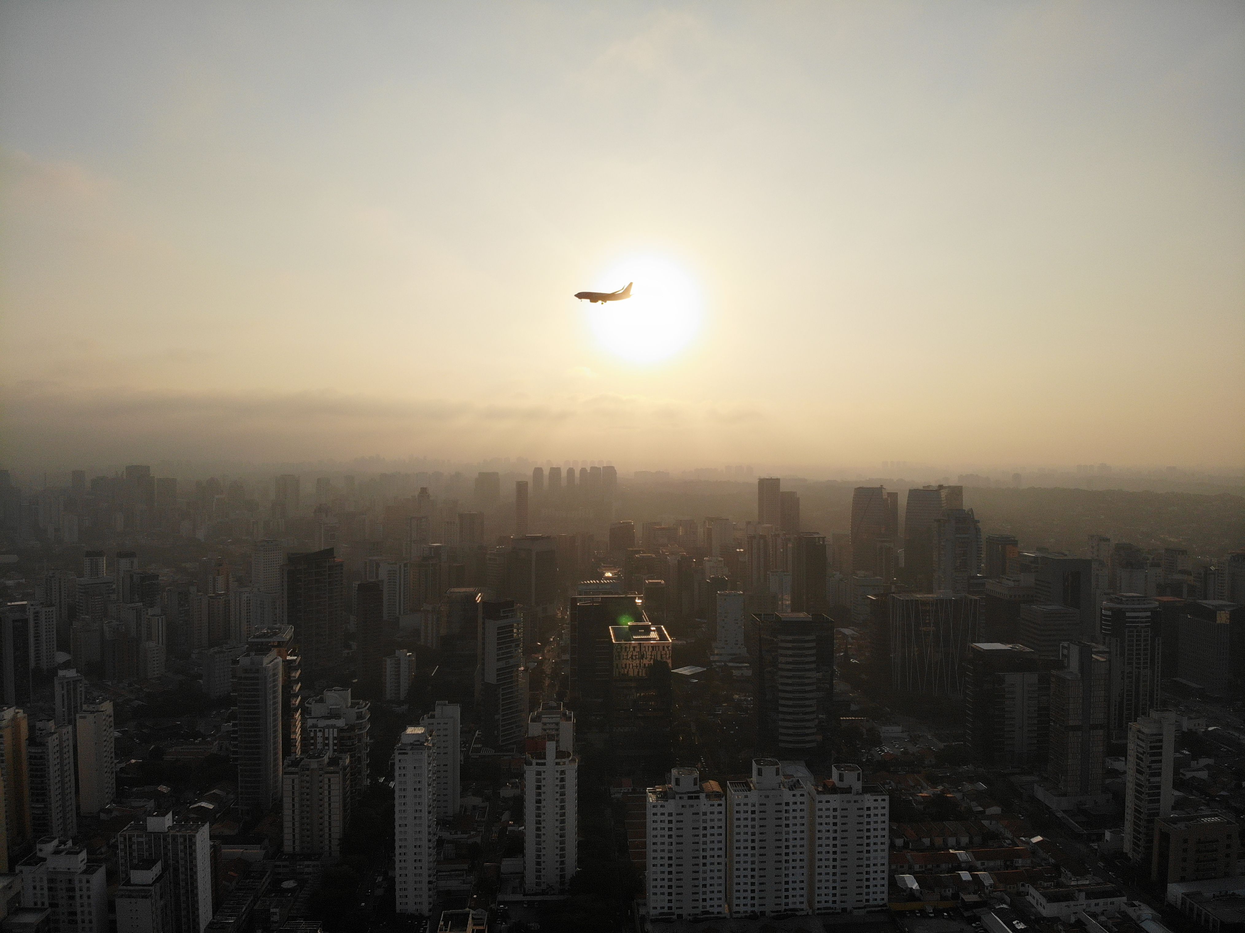 Aerial View of São Paulo with Airplane at Sunset · Free Stock Photo