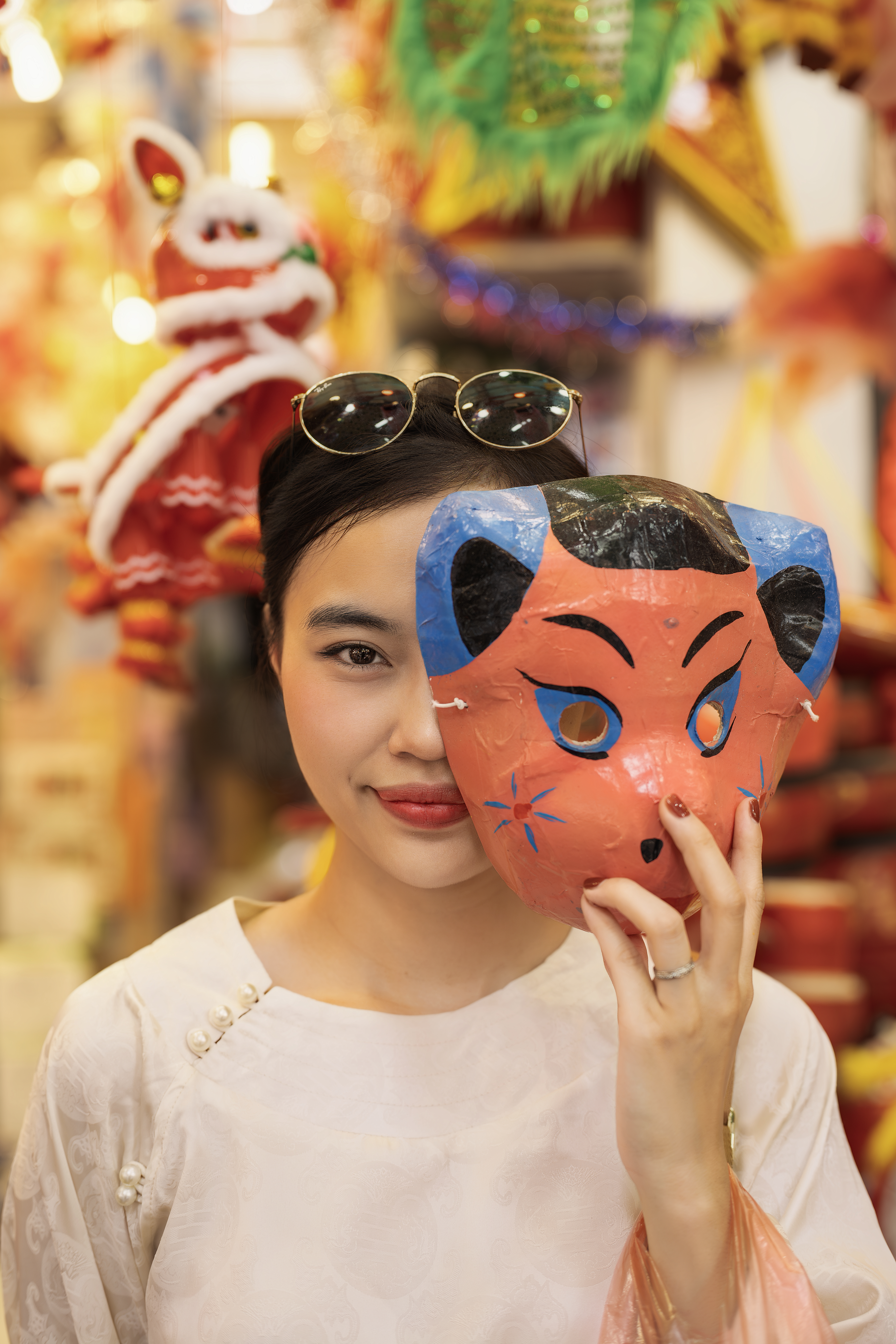 Young Woman with Traditional Vietnamese Mask in Hanoi · Free Stock Photo