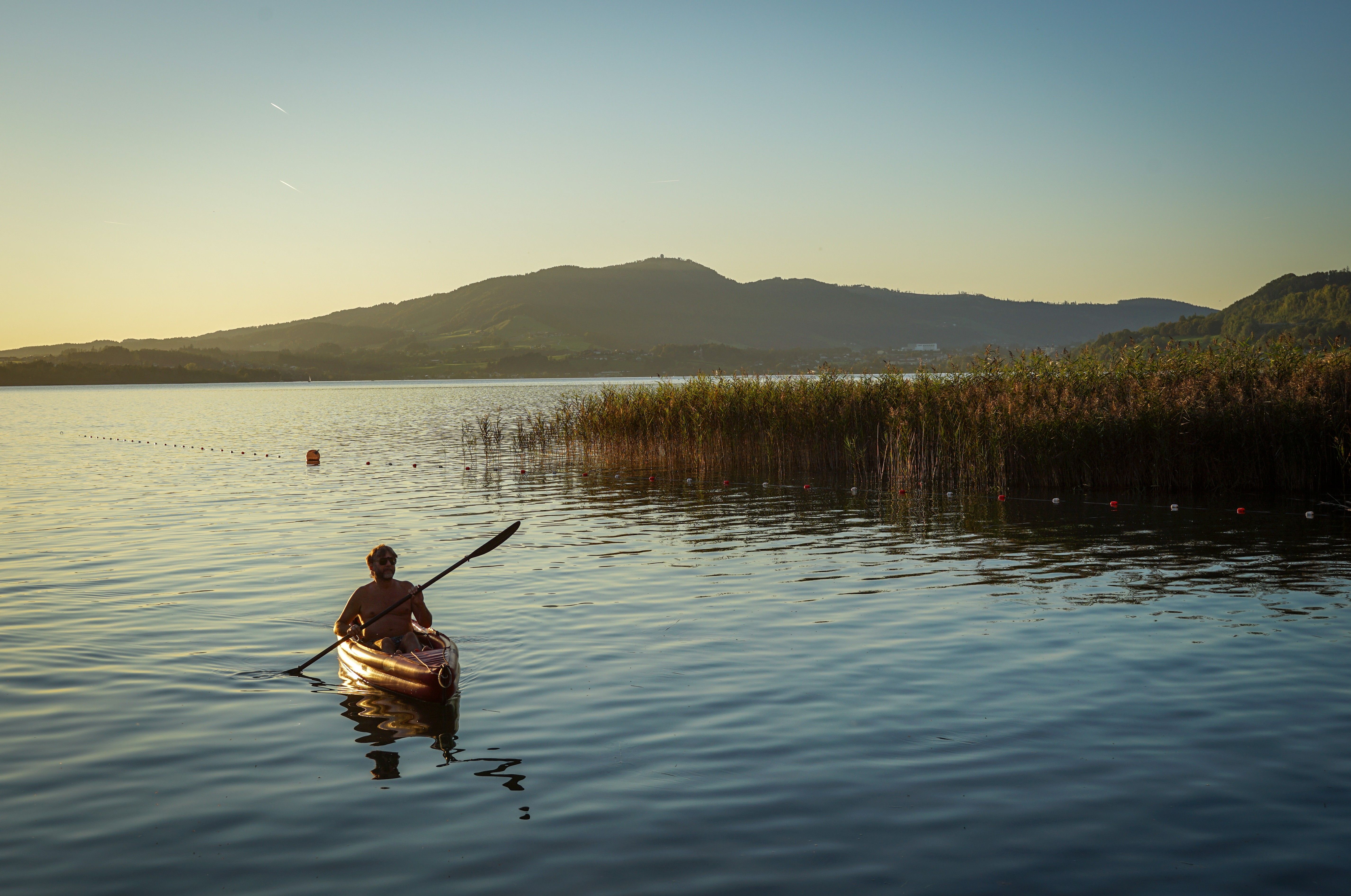 Serene Kayak Adventure at Sunset on Lake · Free Stock Photo