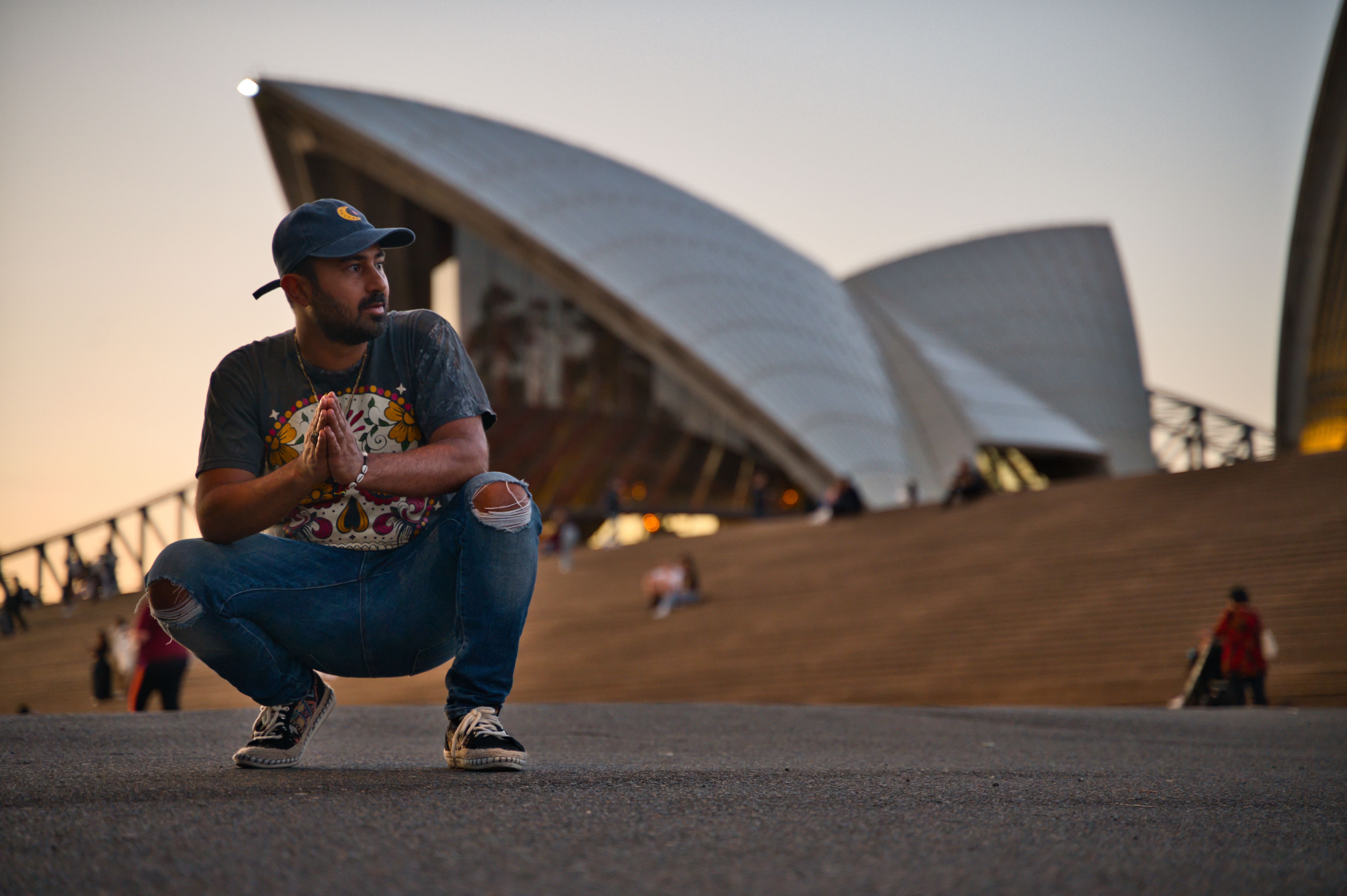 Man Posing in Front of Sydney Opera House at Dusk · Free Stock Photo