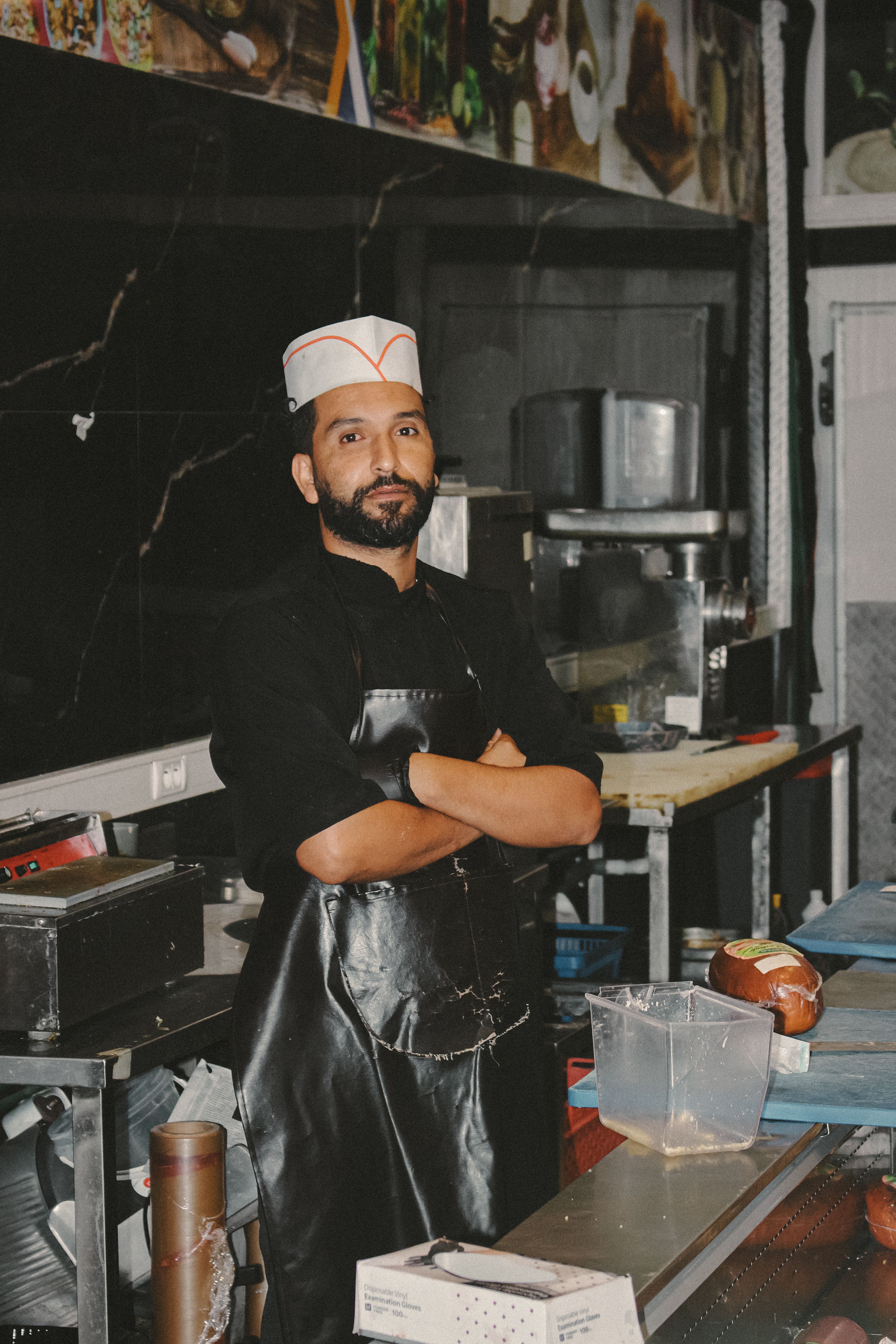 Chef in Restaurant Kitchen with Arms Crossed · Free Stock Photo
