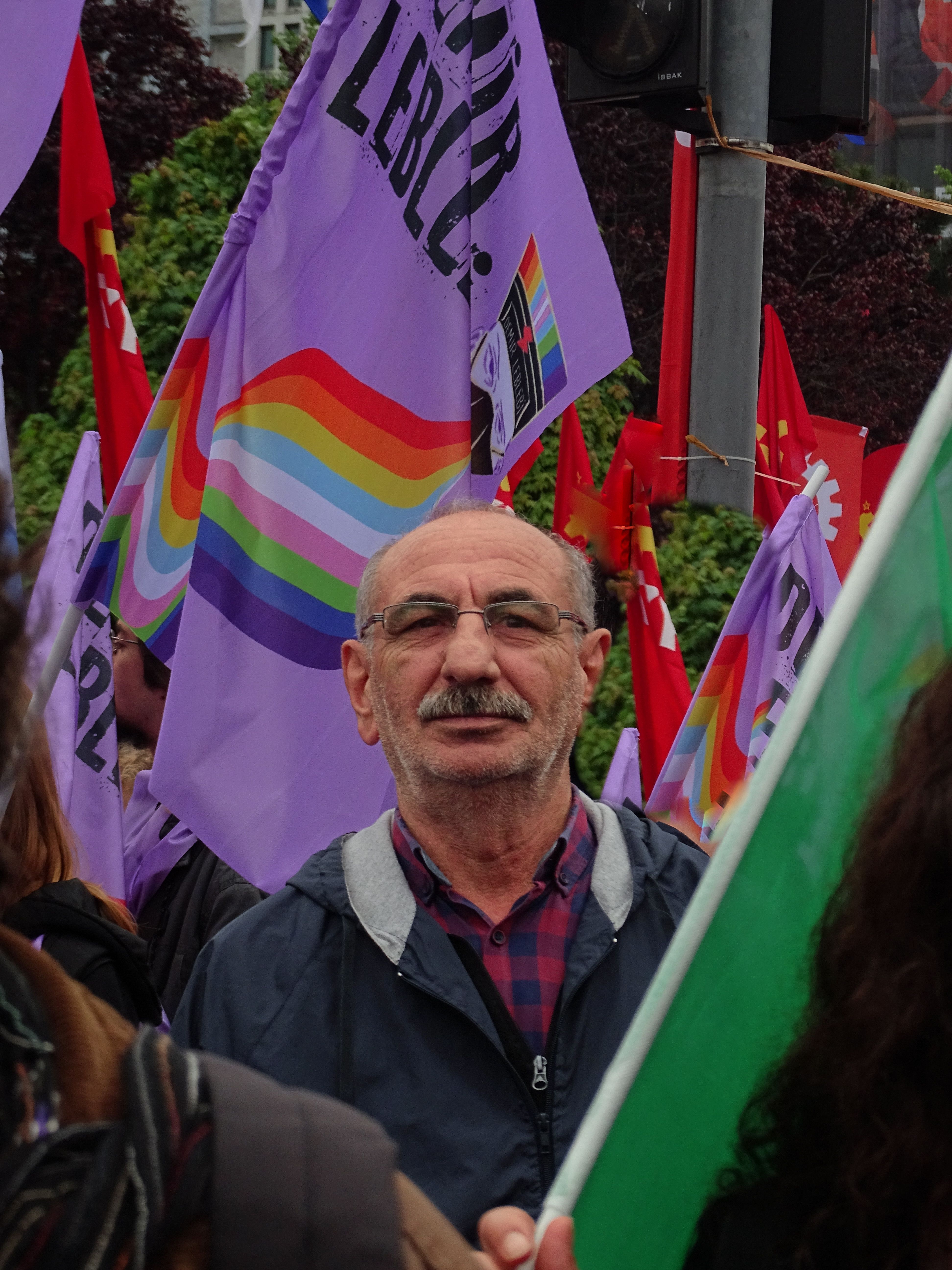 Diverse Protest with Rainbow Flags and Participants · Free Stock Photo