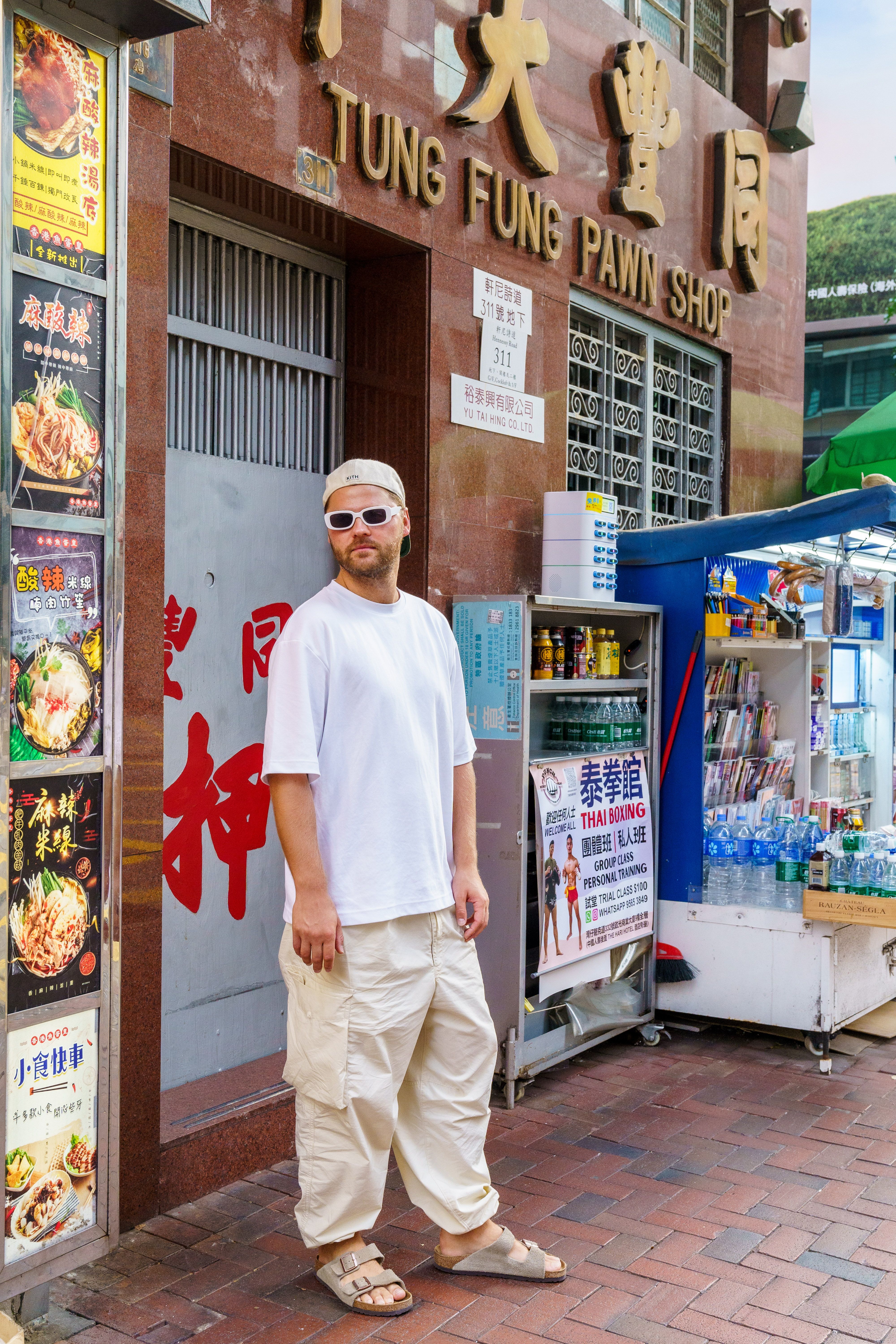Man outside Tung Fung Pawn Shop Hong Kong · Free Stock Photo