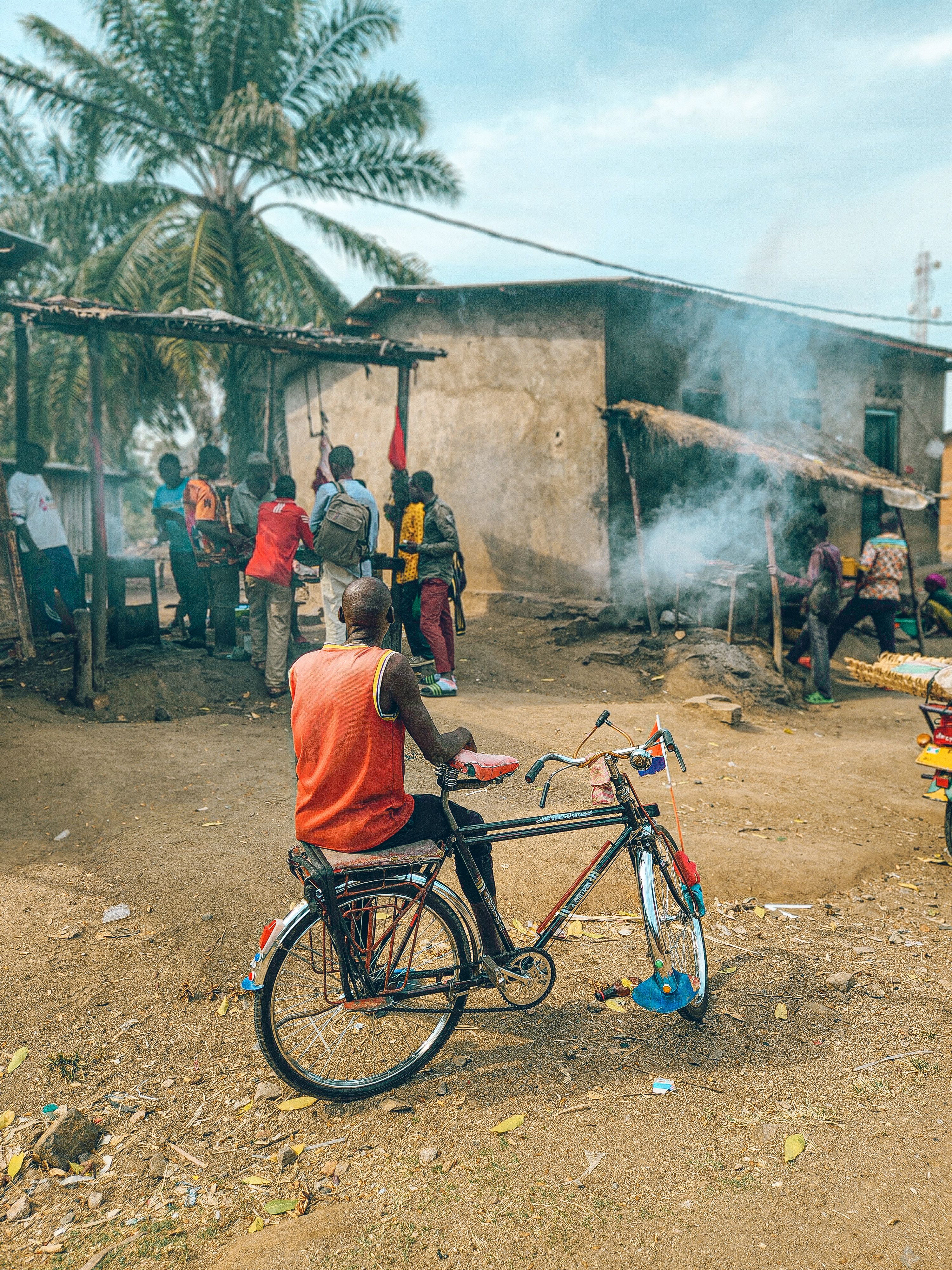 Rural African village life with bicycle · Free Stock Photo