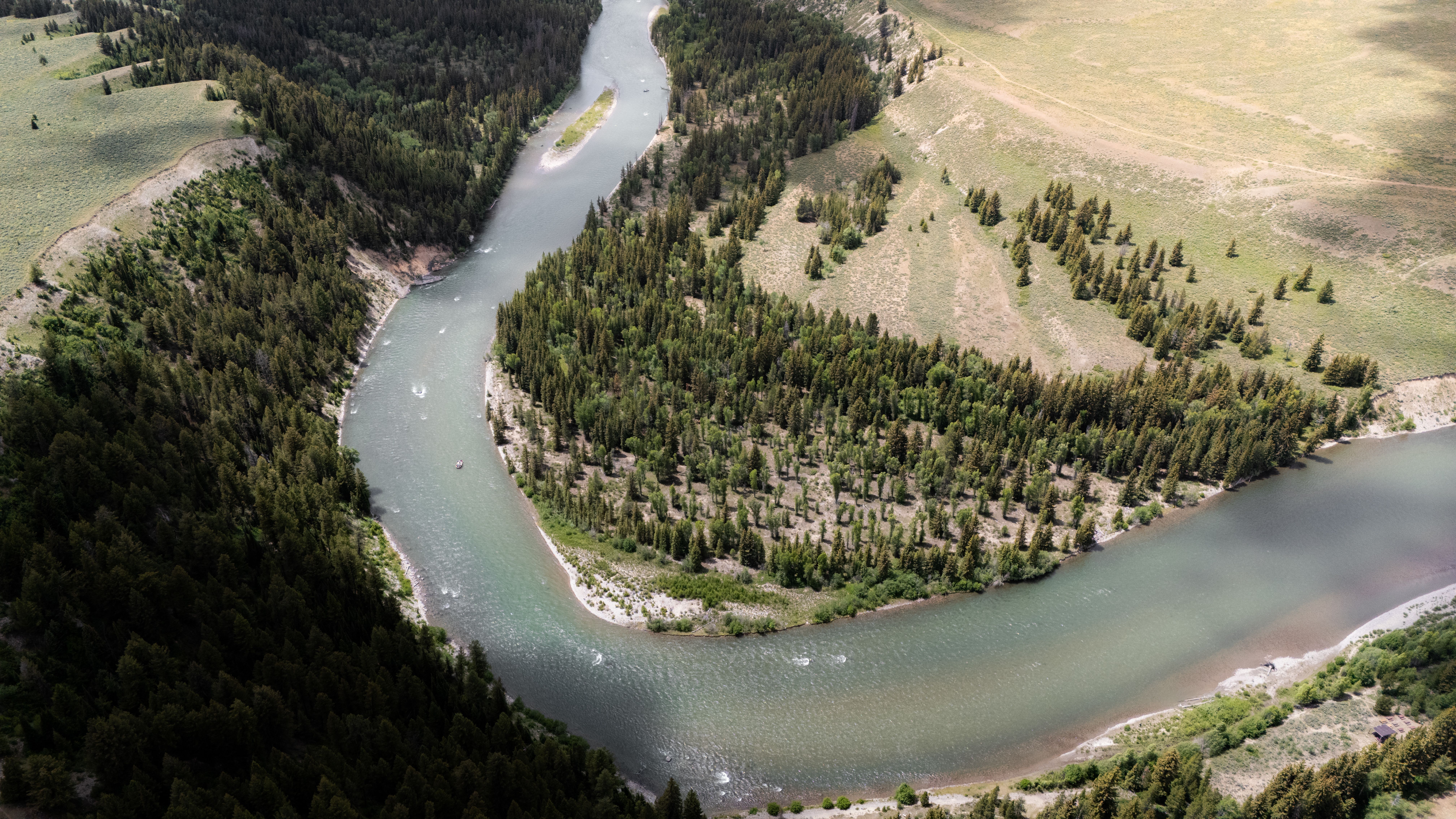 Scenic Aerial View of Meandering River through Forest · Free Stock Photo