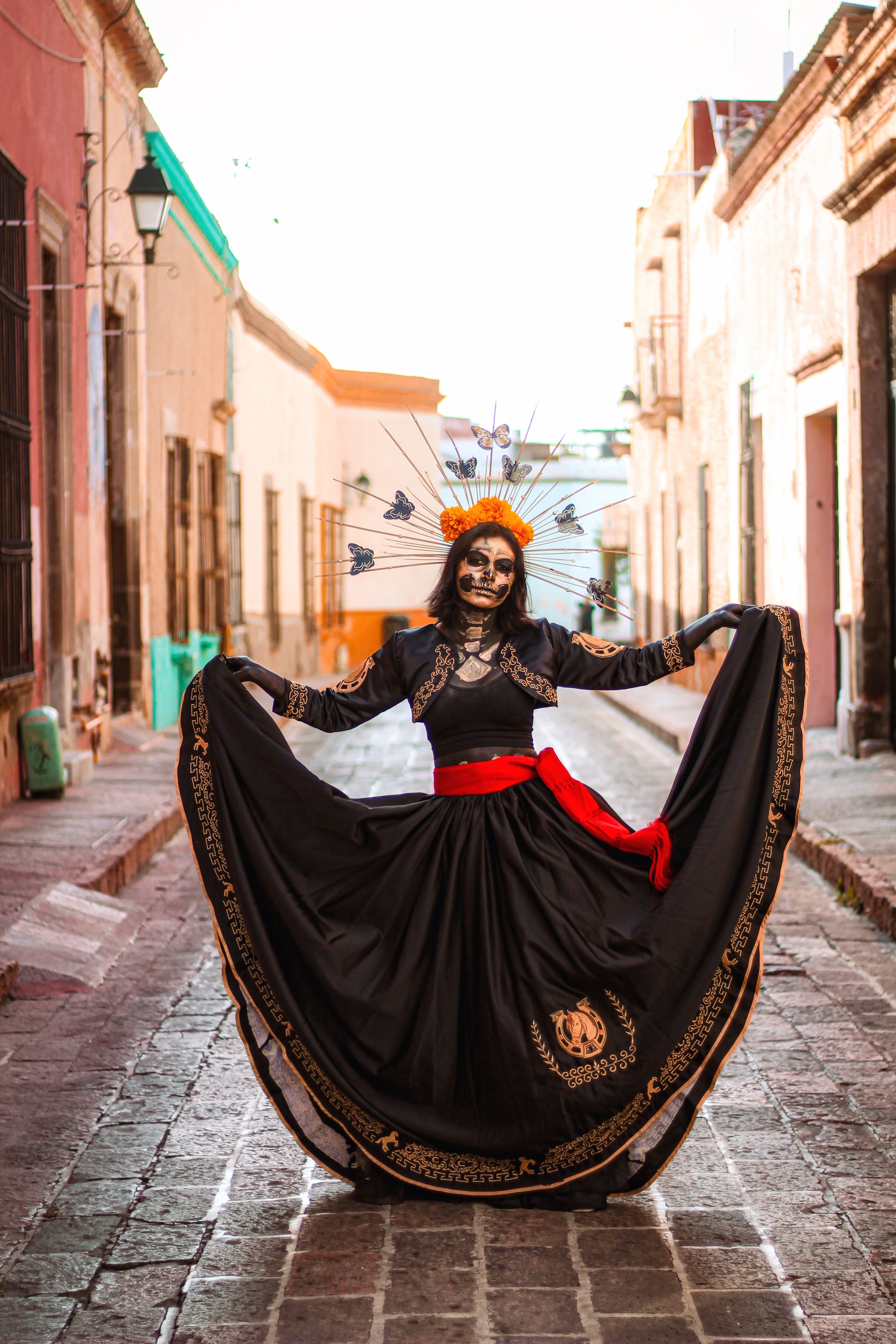 Calavera Catrina Dancing on the Sidewalk · Free Stock Photo