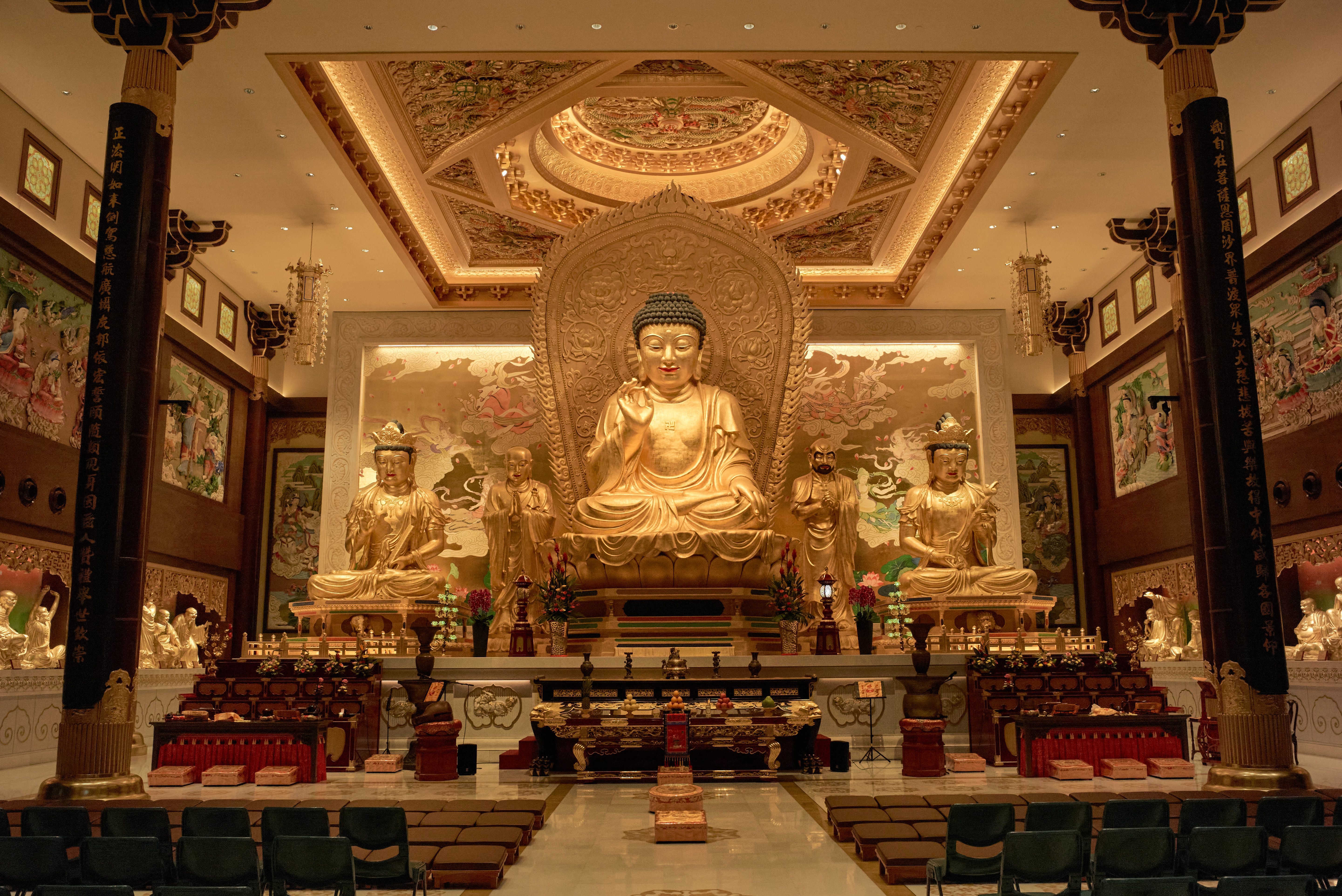 Majestic Buddha Statue in Ornate Temple Interior · Free Stock Photo